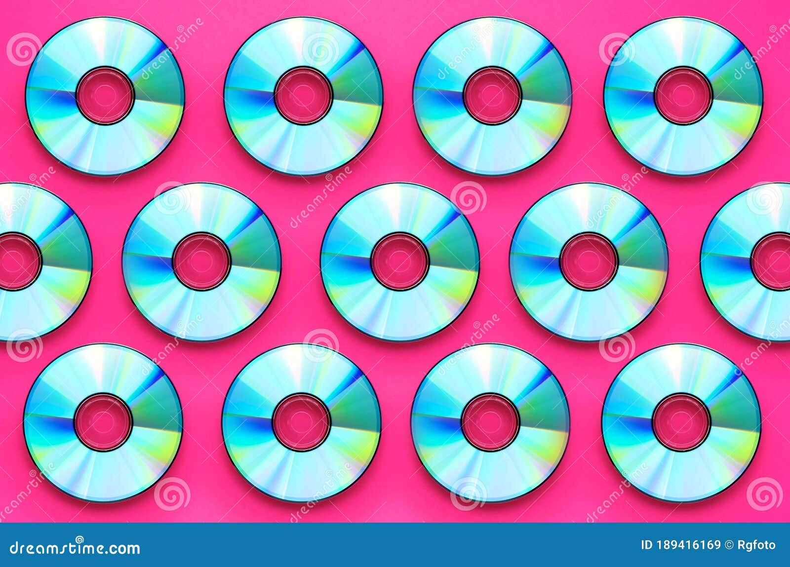 Shiny Compact Disk or DVD on Pink Background Stock Image - Image of ...