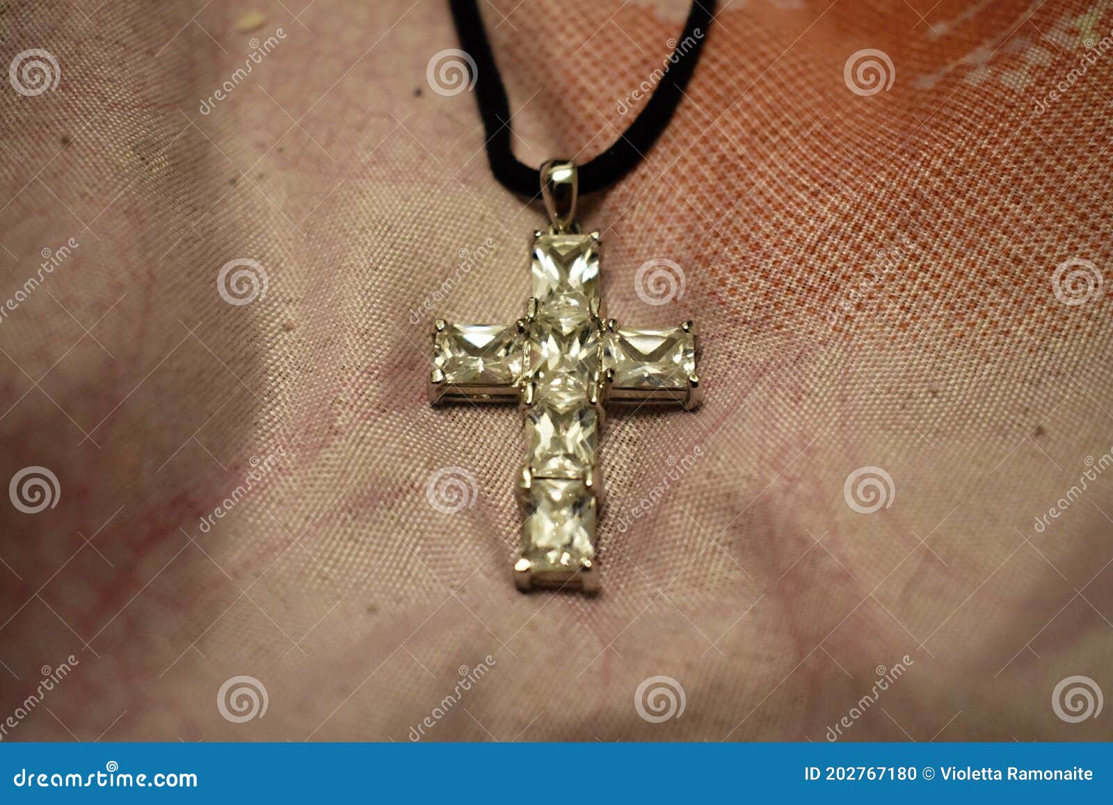 Shiny Decorative Cross Pendant on a Black Rope Stock Photo - Image of ...