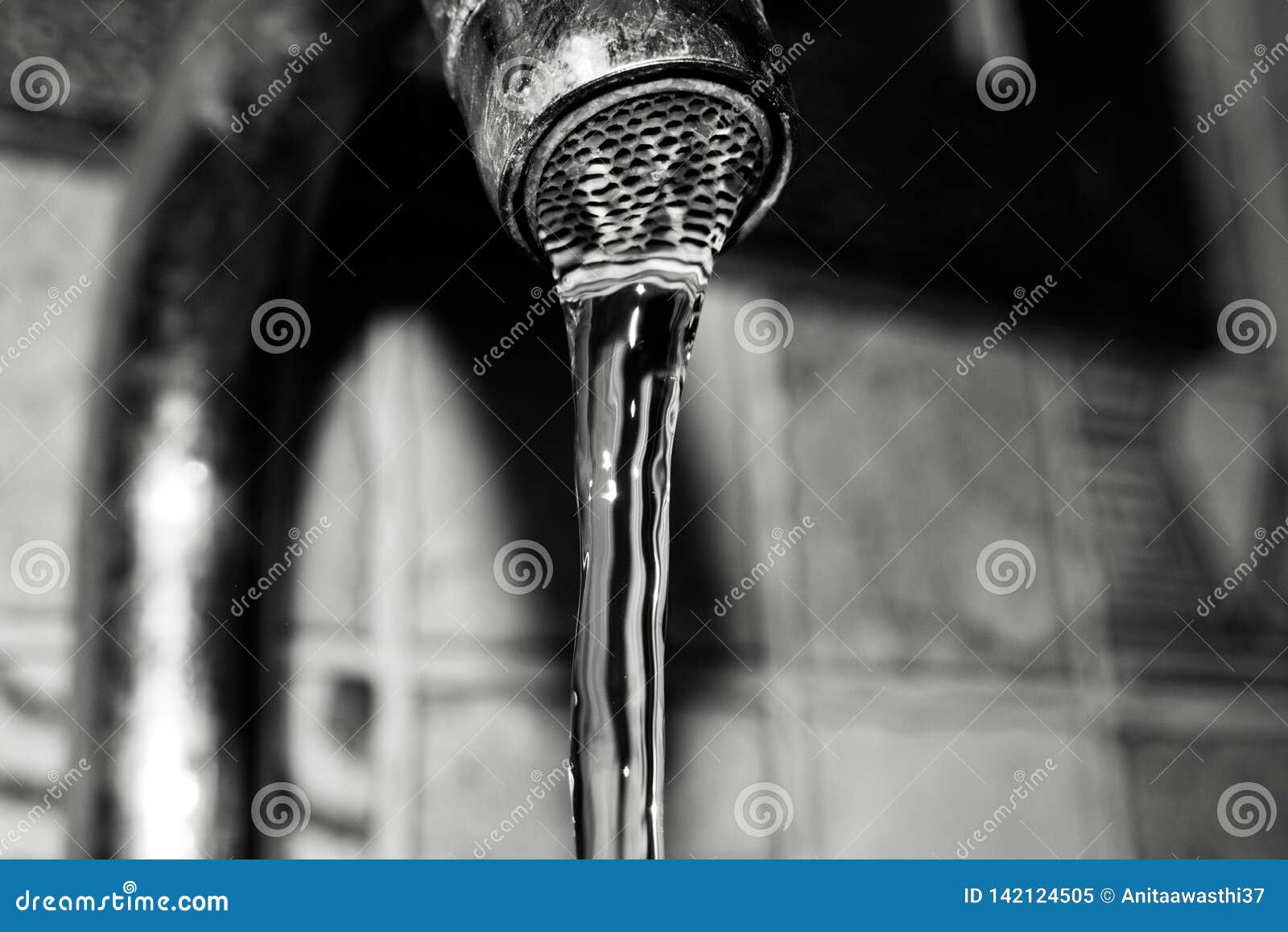 Crystal Clear Fresh Water Stream From Metal Tap Black And White Stock