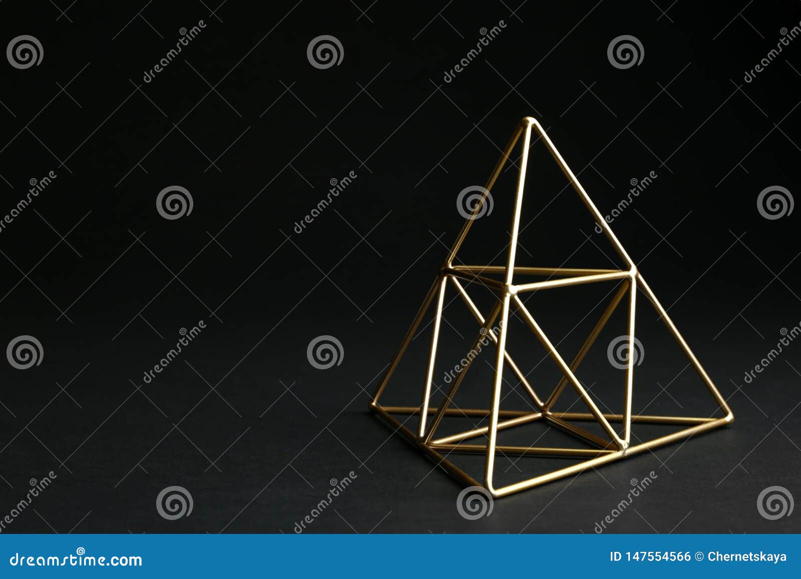 Shiny Decorative Gold Pyramid on Black Background. Stock Photo - Image ...
