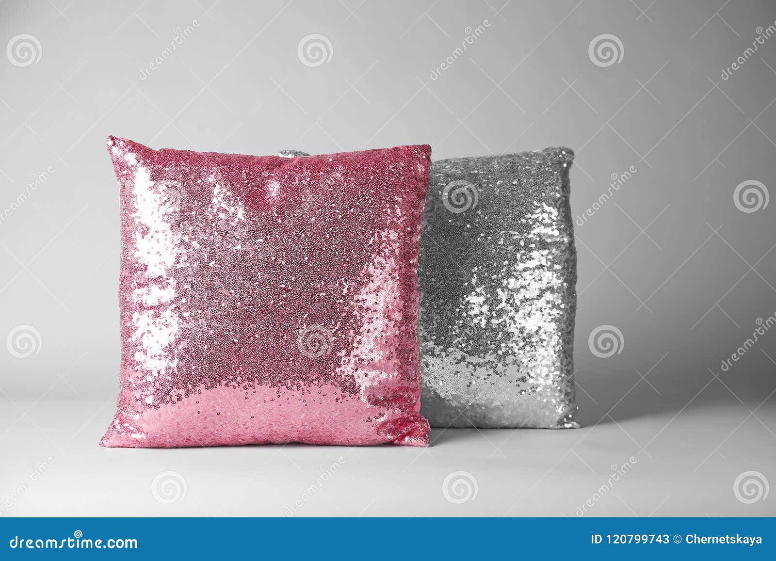 Shiny decorative pillows stock image. Image of bedroom - 120799743