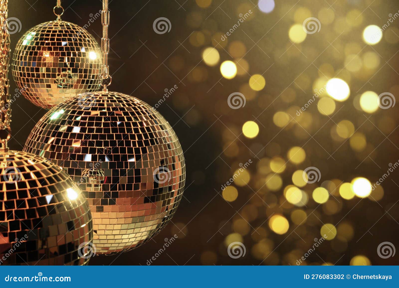 Shiny Disco Balls Under Yellow Light, Space for Text Stock Photo ...