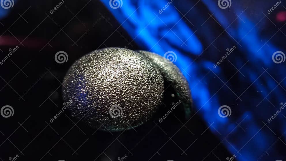 Shiny Ear Rings on a Reflective Surface Stock Image - Image of white ...