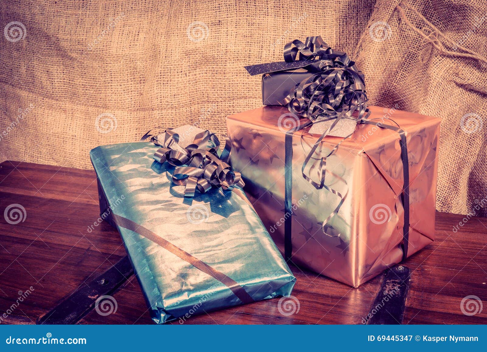 Shiny Gift Boxes on a Wooden Table Stock Image - Image of christmas ...