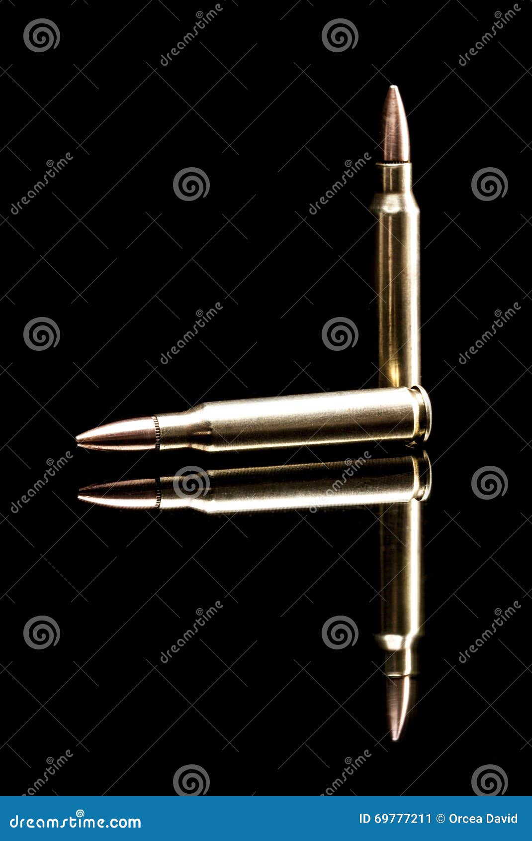 Shiny Gold Bullets stock image. Image of isolated, brass - 69777211