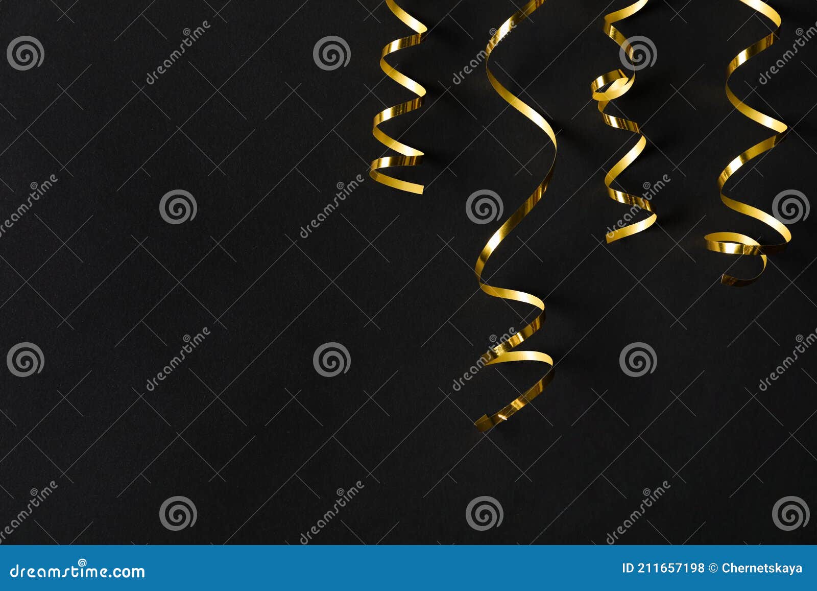 Shiny Golden Serpentine Streamers on Black Background, Flat Lay. Space ...