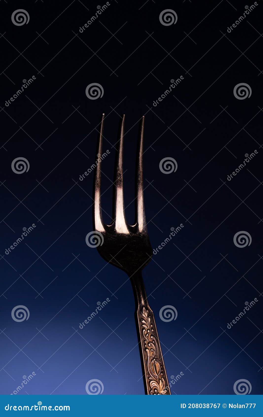 Shiny Metal Fork with Three Prongs on Blue Stock Image - Image of steel ...