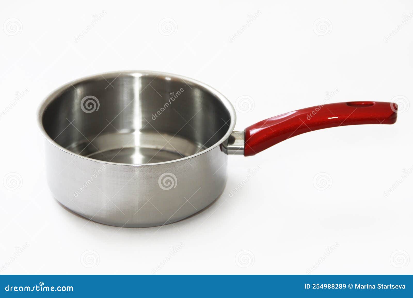 Shiny Metal Ladle with Red Handle for Cooking on a White Background ...