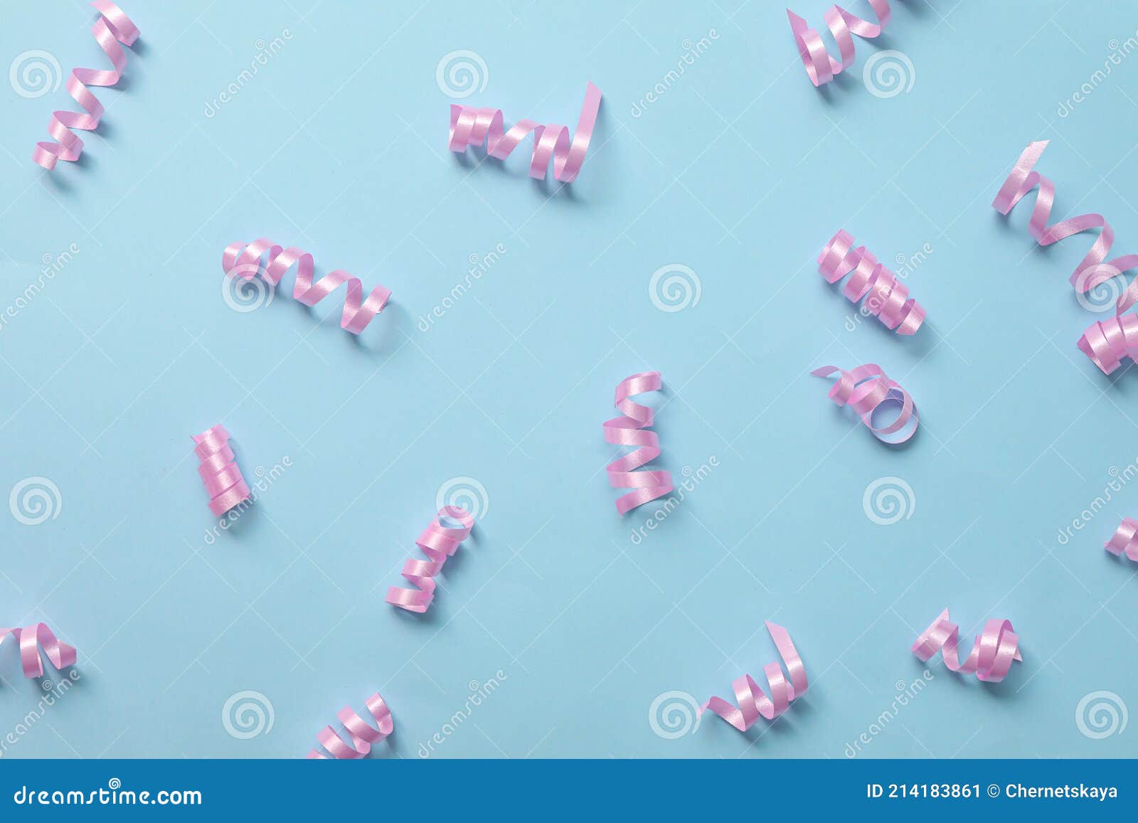 Shiny Pink Serpentine Streamers Light Blue Background, Flat Lay Stock ...