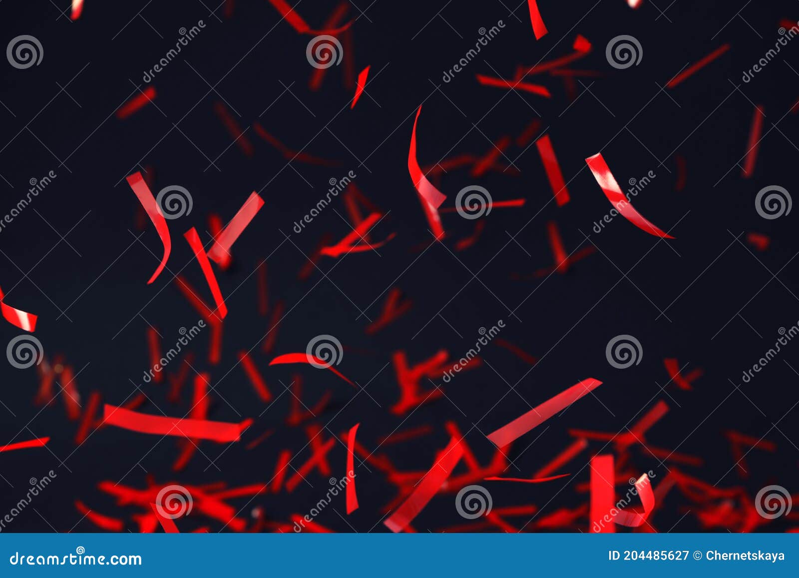 Shiny Red Confetti Falling Down on Dark Blue Background Stock Image ...