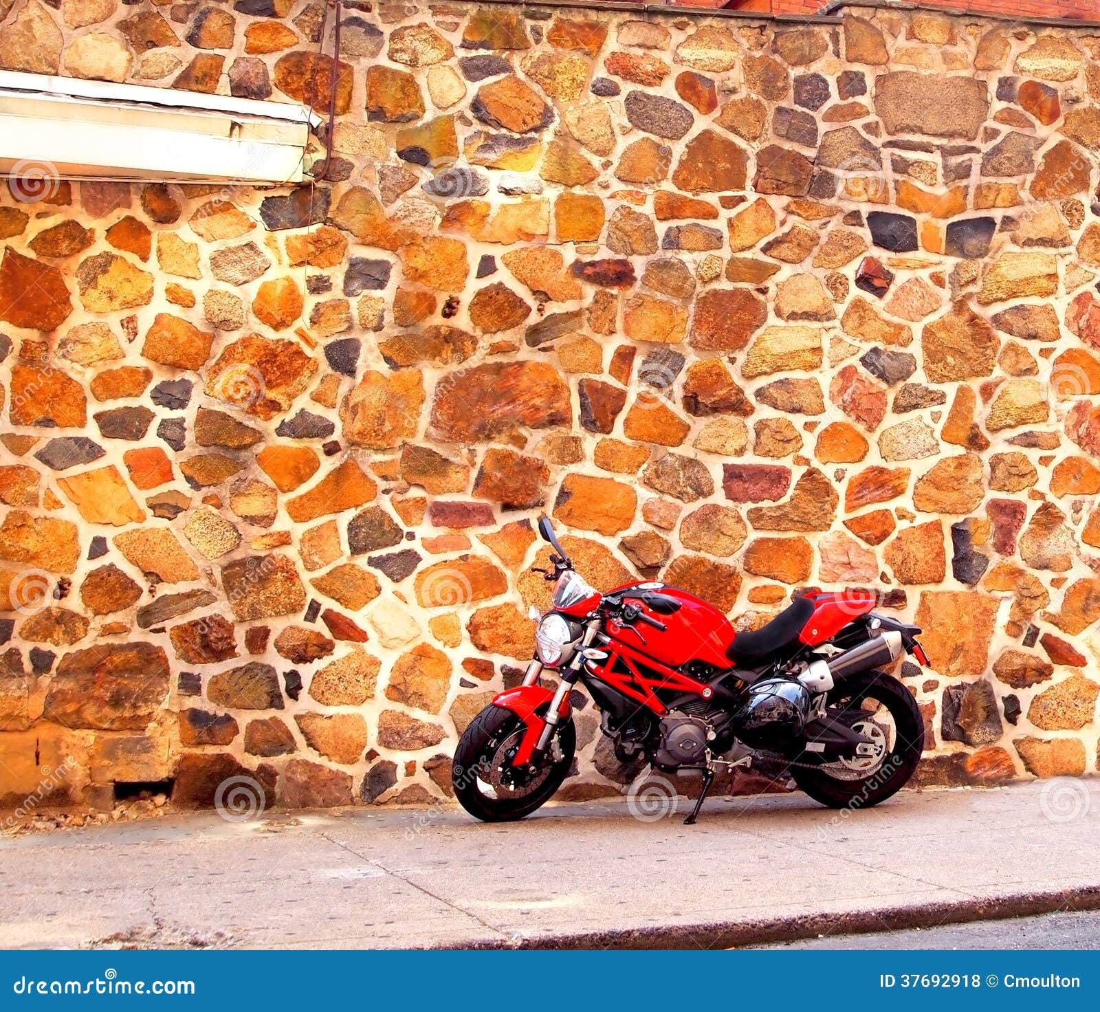 Shiny Red Motorcycle Parked by Stone Wall Stock Photo - Image of stone ...