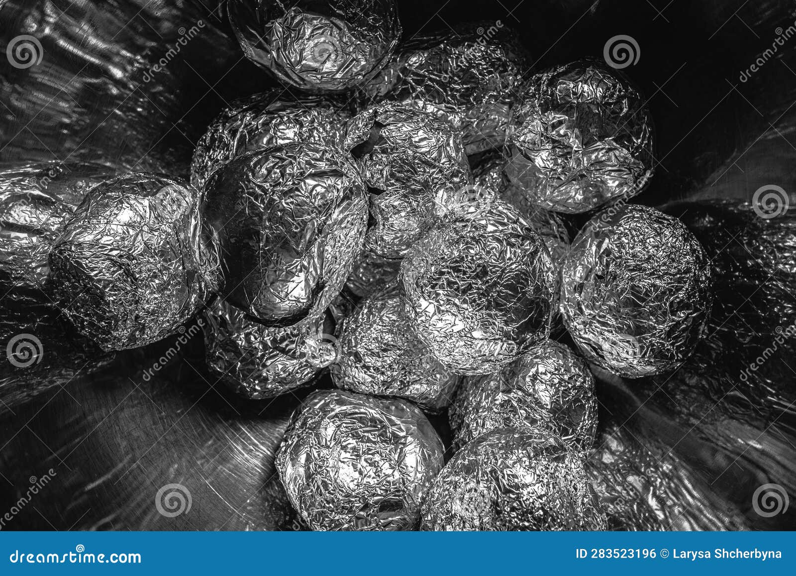 Shiny Round Objects Wrapped in Foil in Black and White Image Stock ...