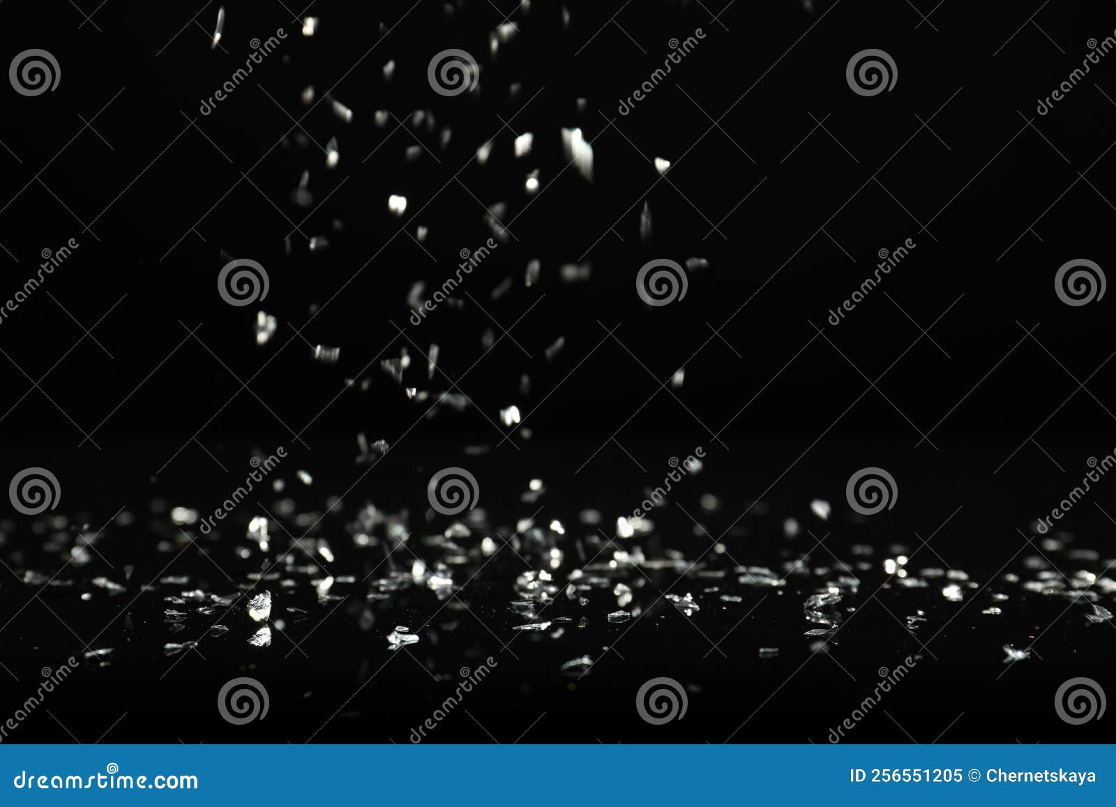 Shiny Silver Glitter Falling Down on Black Background. Bokeh Effect ...