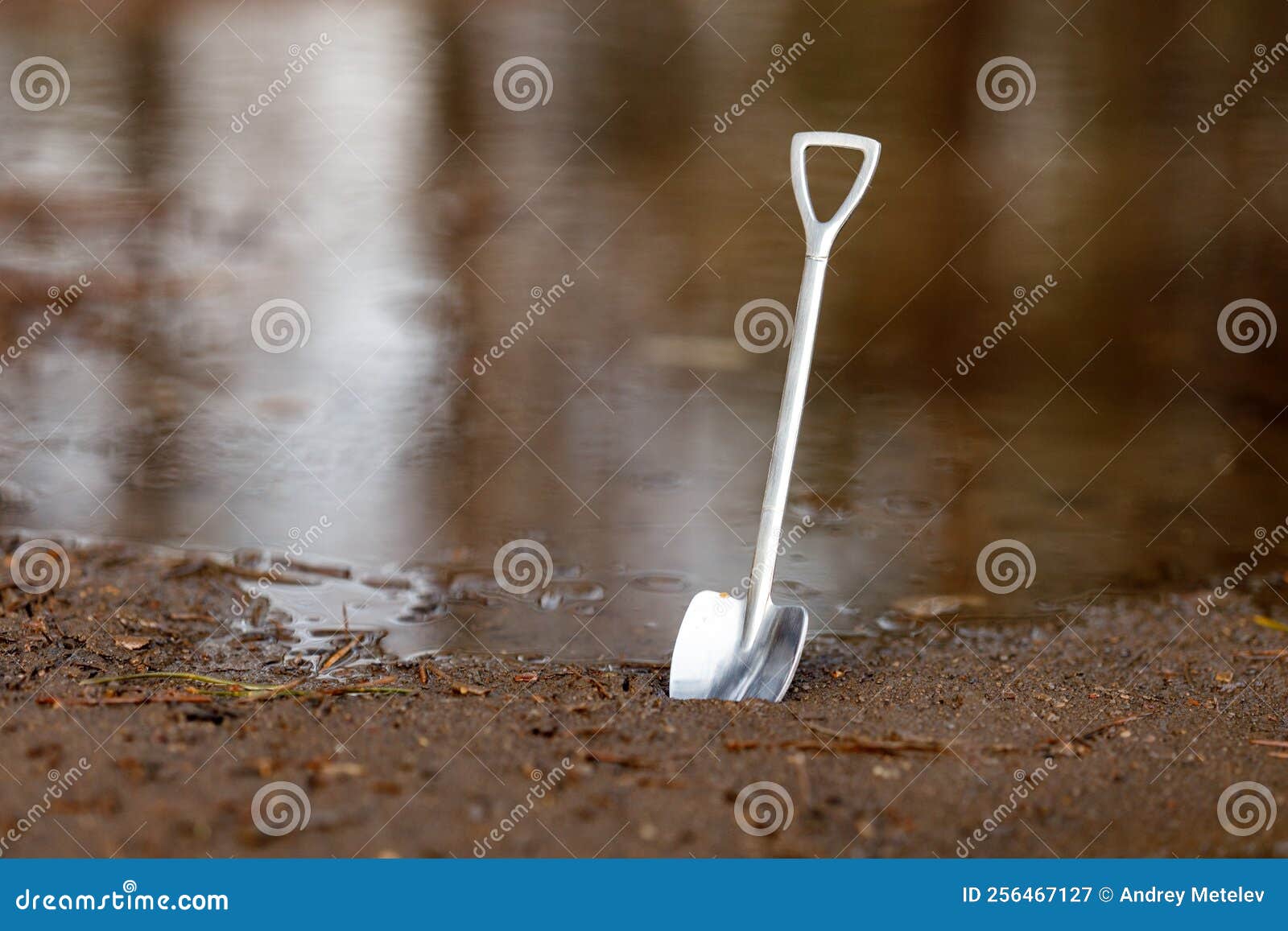 Shiny Steel Shovel by the Pond, Water and Mud Stock Image - Image of ...