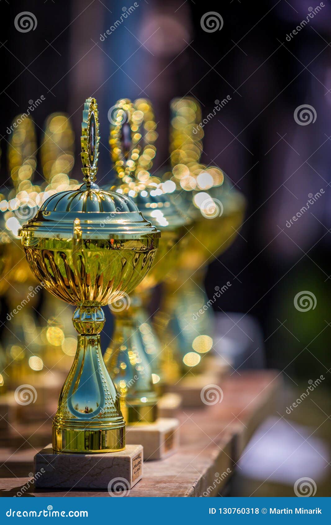Shiny Trophies Line Up on the Table Stock Photo - Image of medal ...