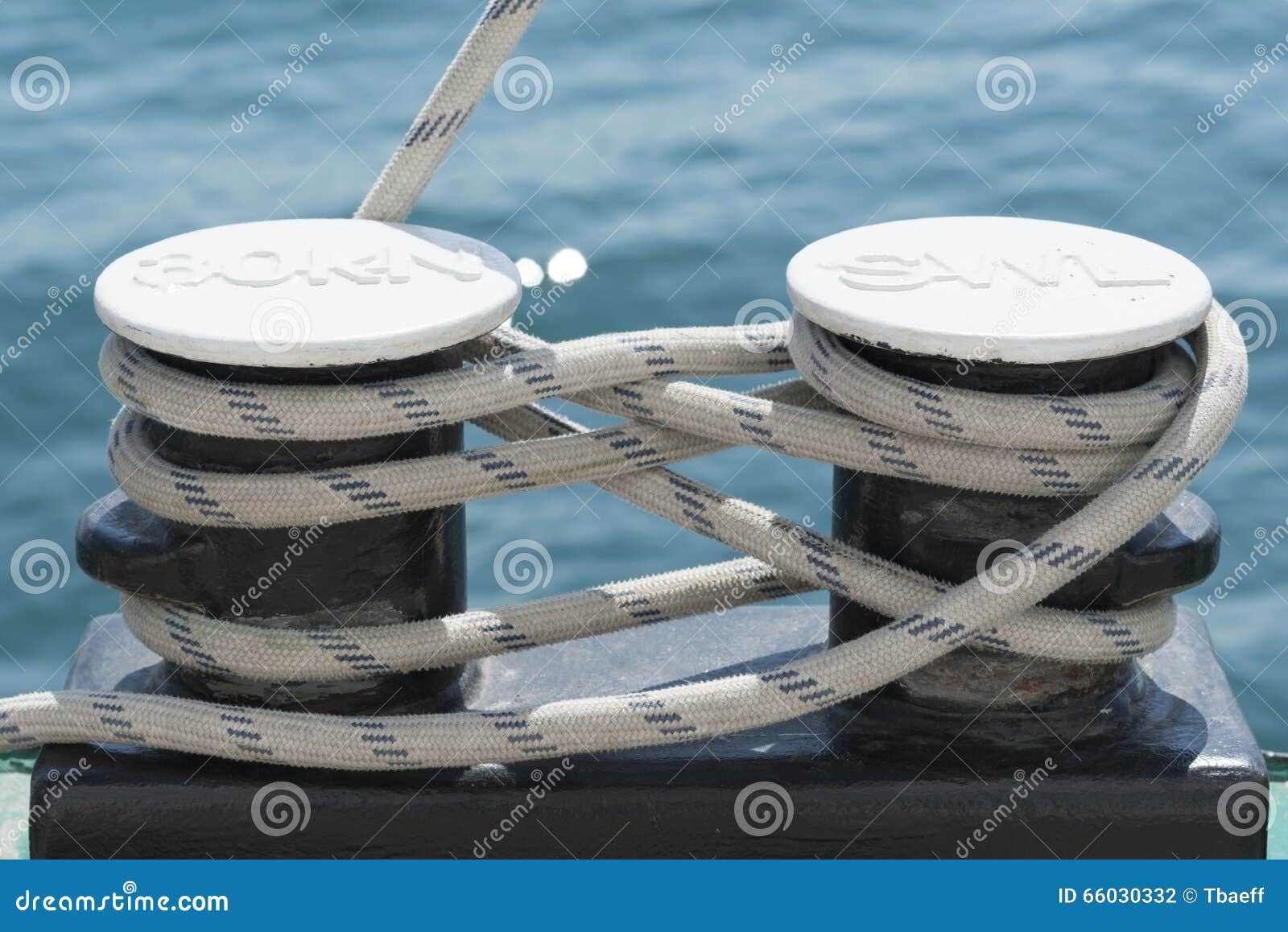 Ship bitt with rope stock photo. Image of rope, line - 66030332