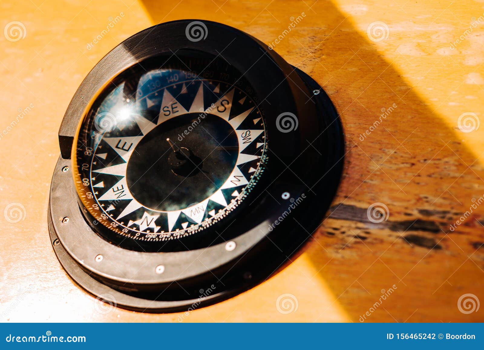 Ship Black Compass on Wood Background Stock Photo - Image of vacation ...