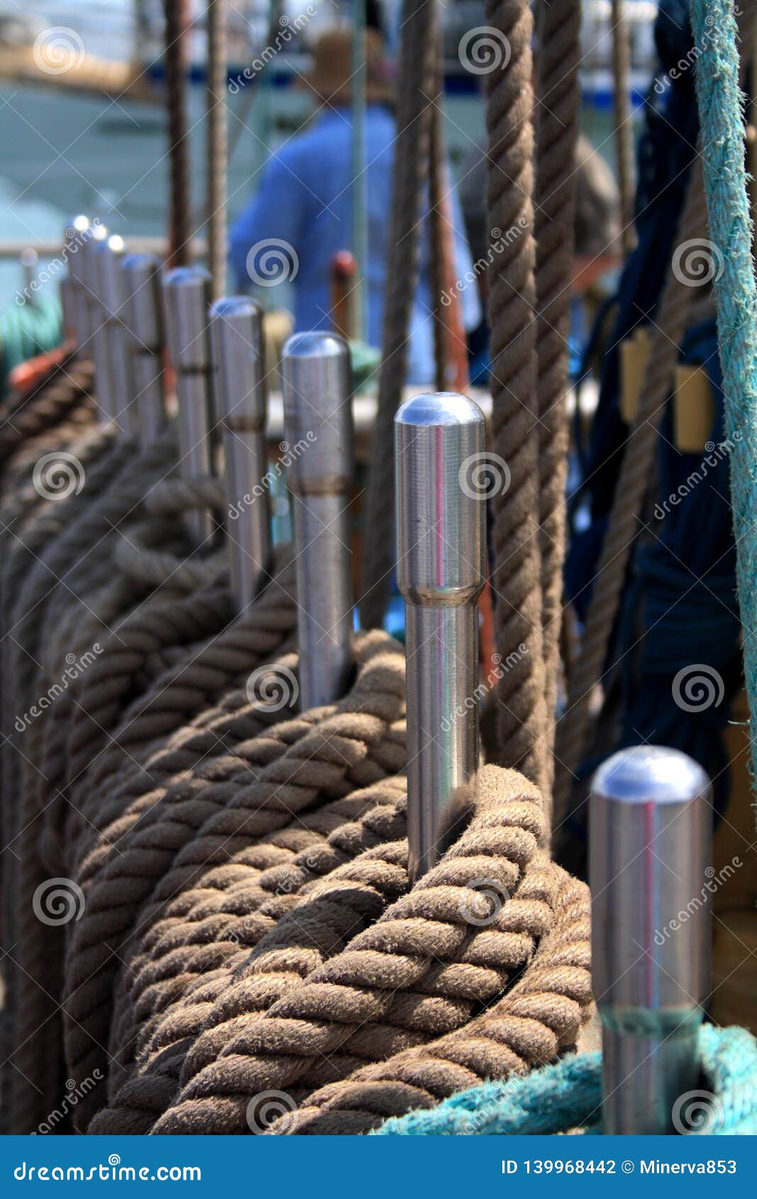 Ship Brown Ropes on the Rails with a Man on the Background. Stock Photo ...