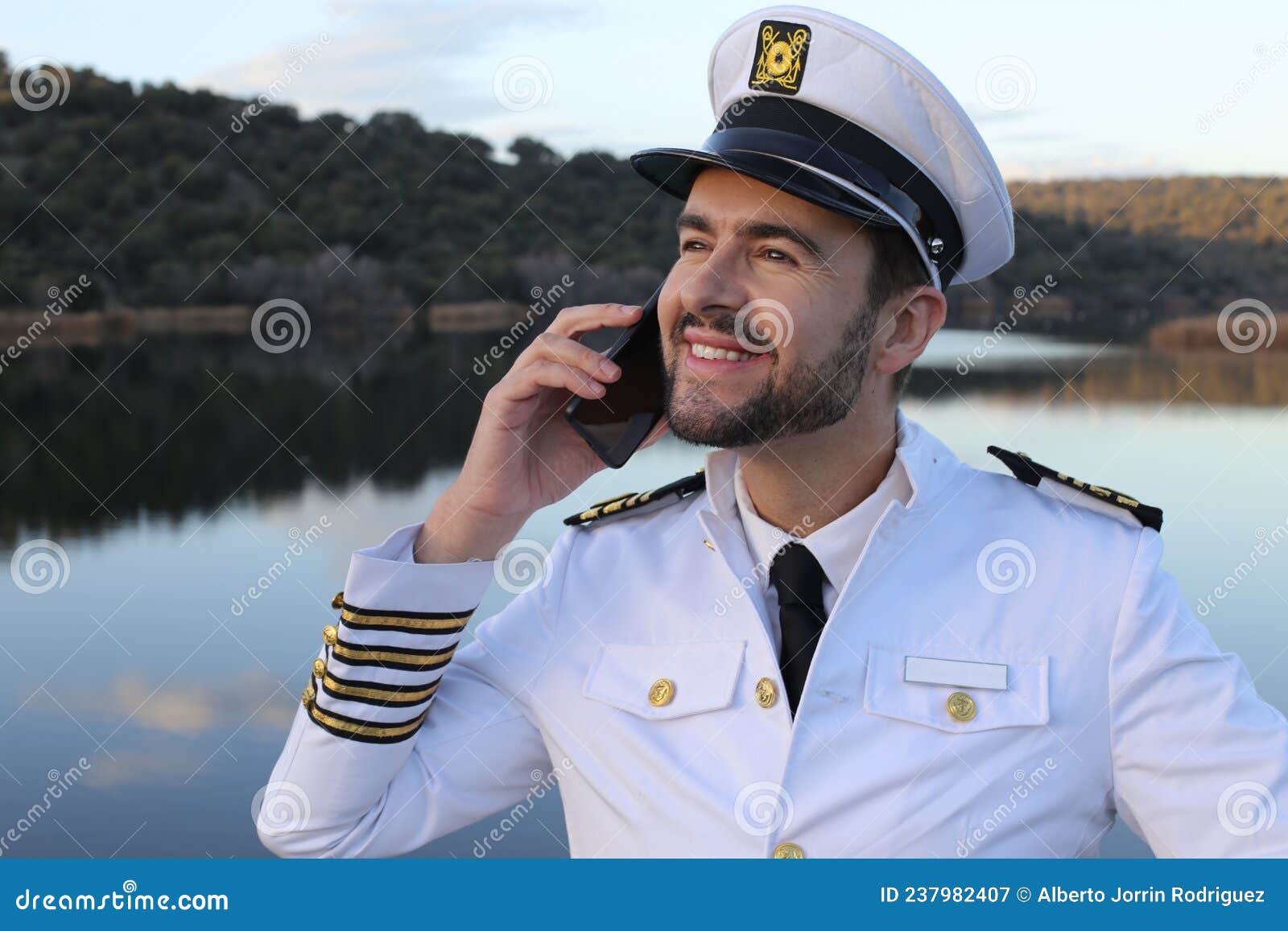 Ship Captain Making a Phone Call Stock Image - Image of clothing, ocean ...