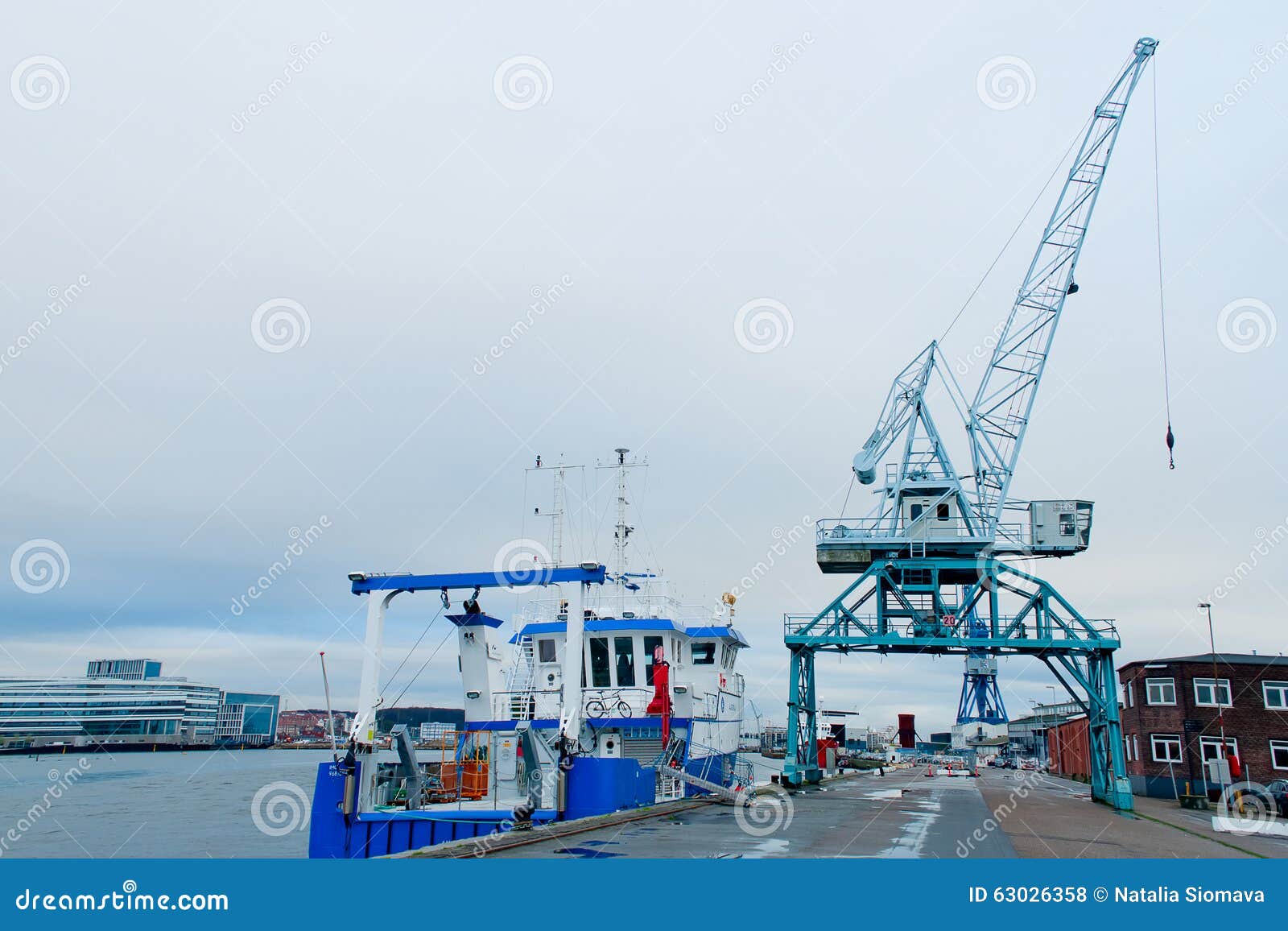 A Ship and Crane in Cargo Terminal, Aarhus, Denmark Stock Photo - Image ...