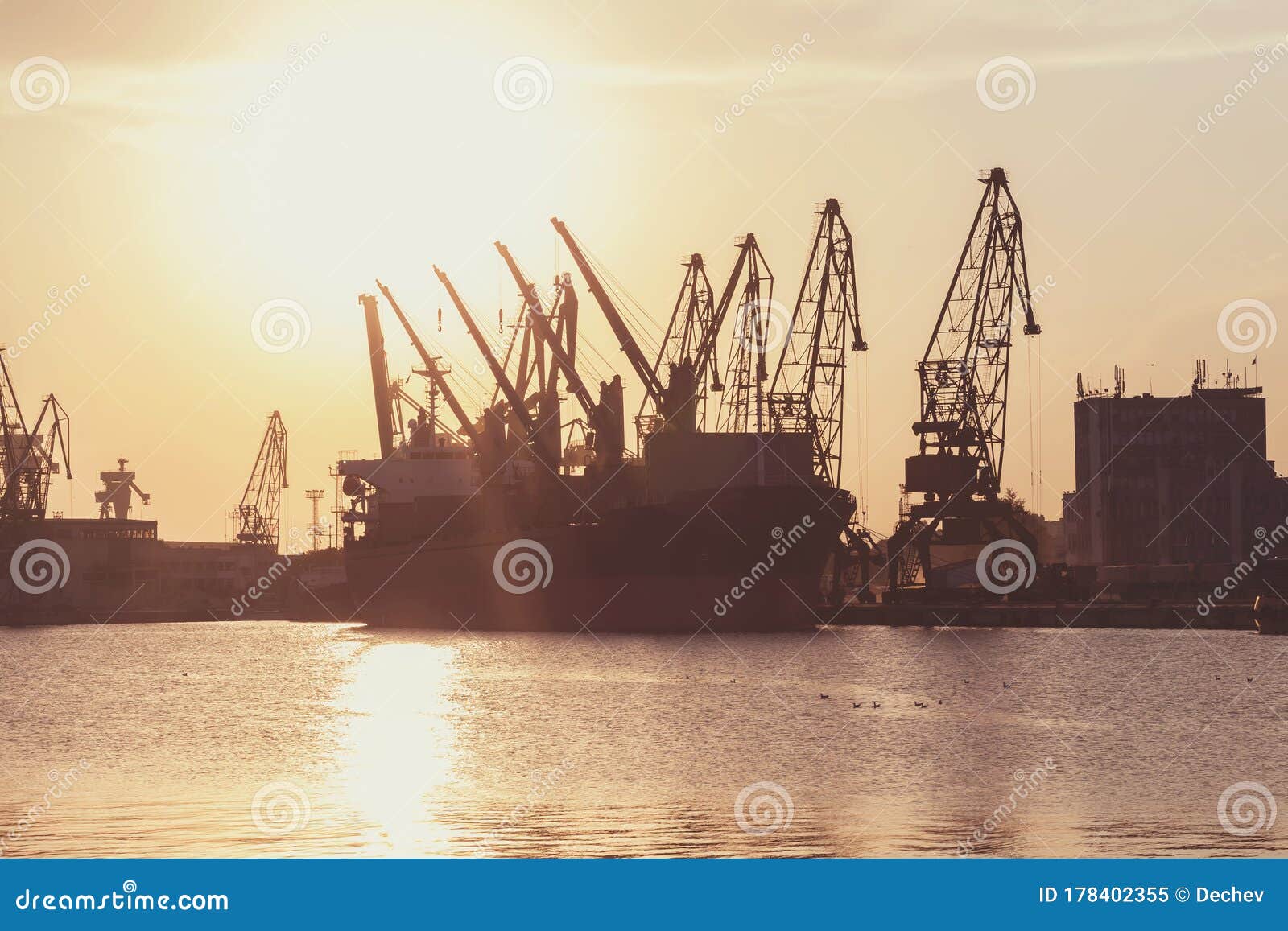 Ship and Cranes at Sunset in Port of Varna, Bulgaria Stock Image ...