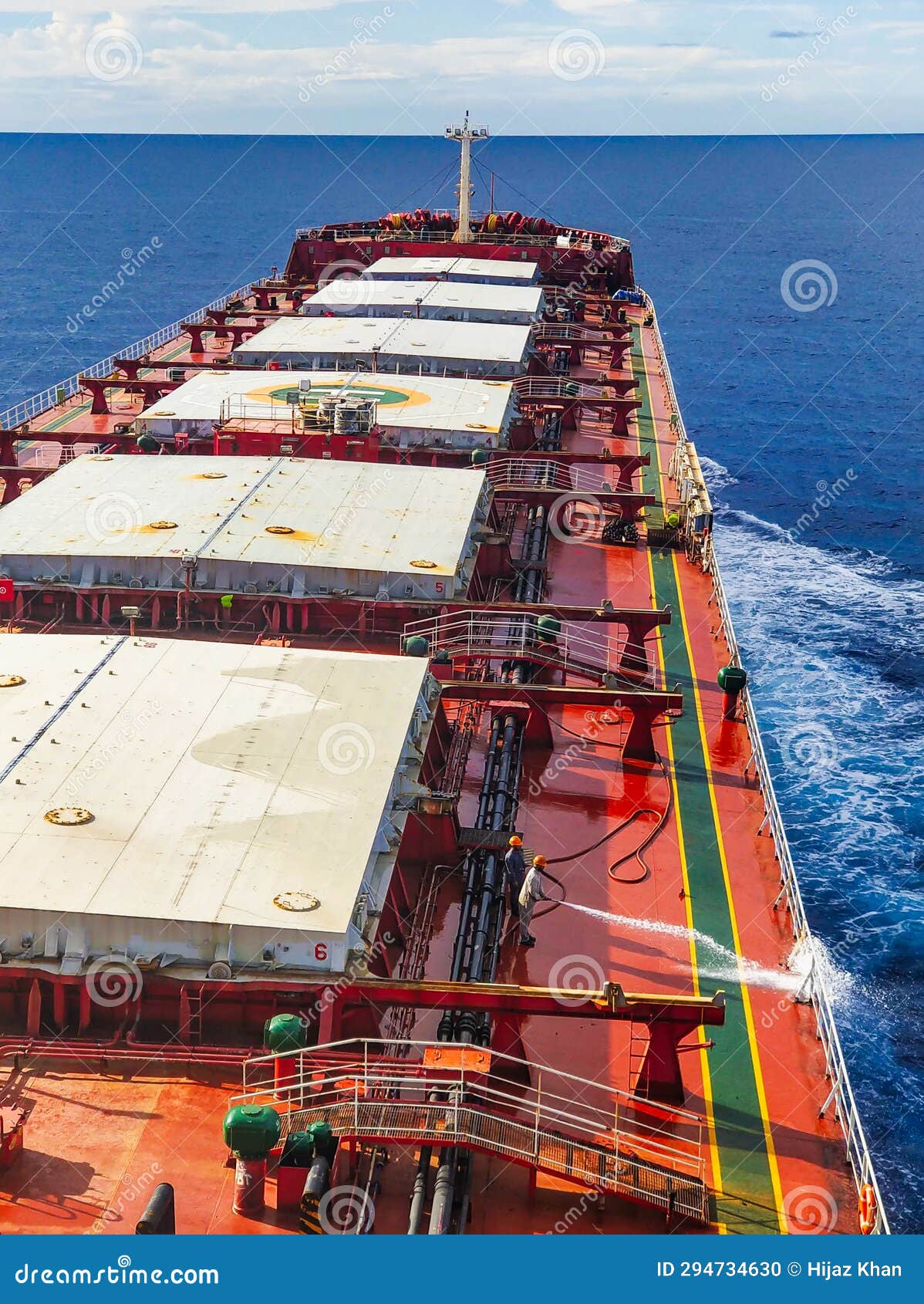 Ship Crew Washing and Cleaning the Ship Deck after Loading Operation ...