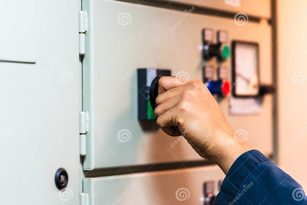 A Ship Engineer S Hand Reaches Toward a Control Panel, Ready To ...