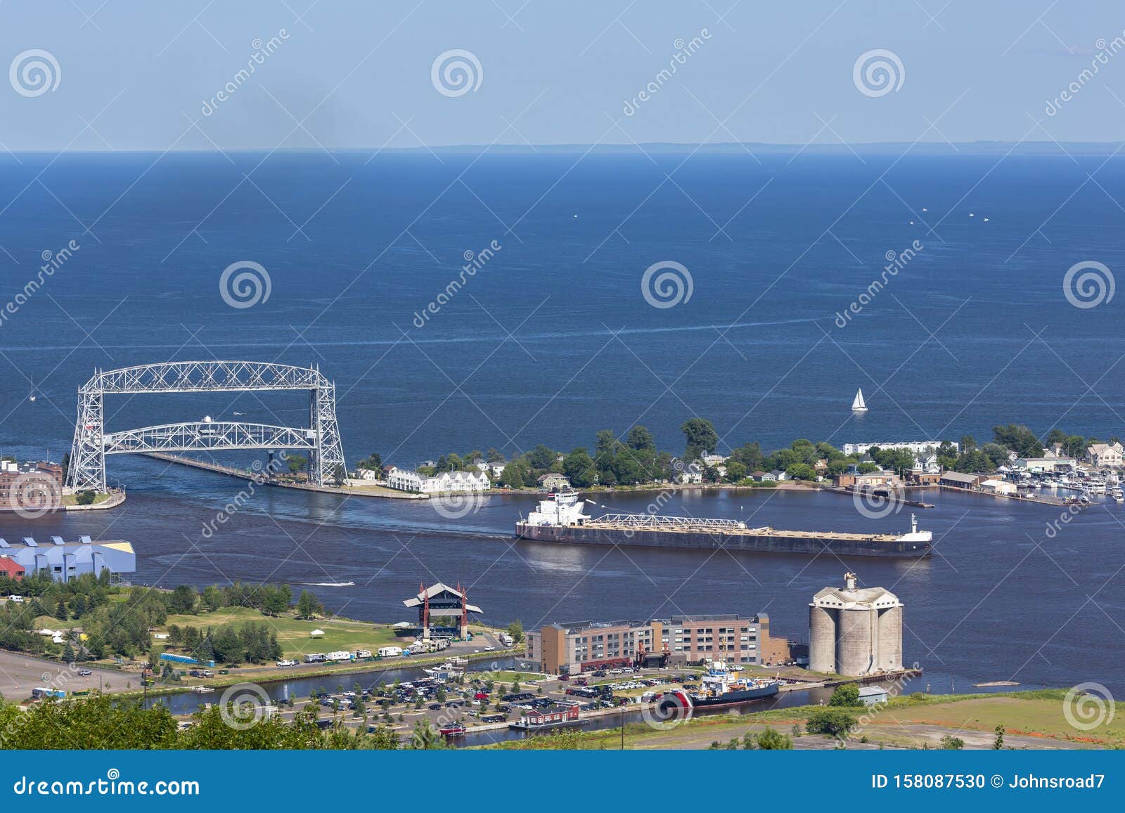 A Ship Entering Duluth Harbor Stock Photo - Image of harbor, lighthouse ...