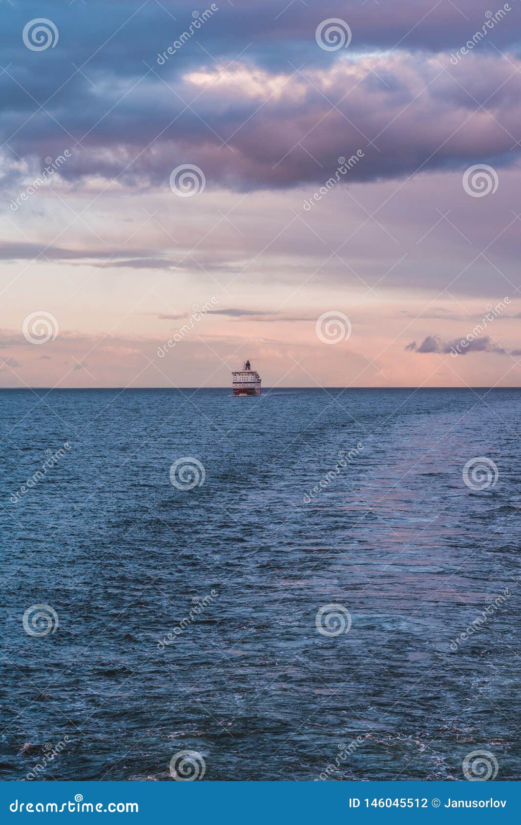 Ship Following in the Horizon with the Sun Going Down, Finland Stock ...
