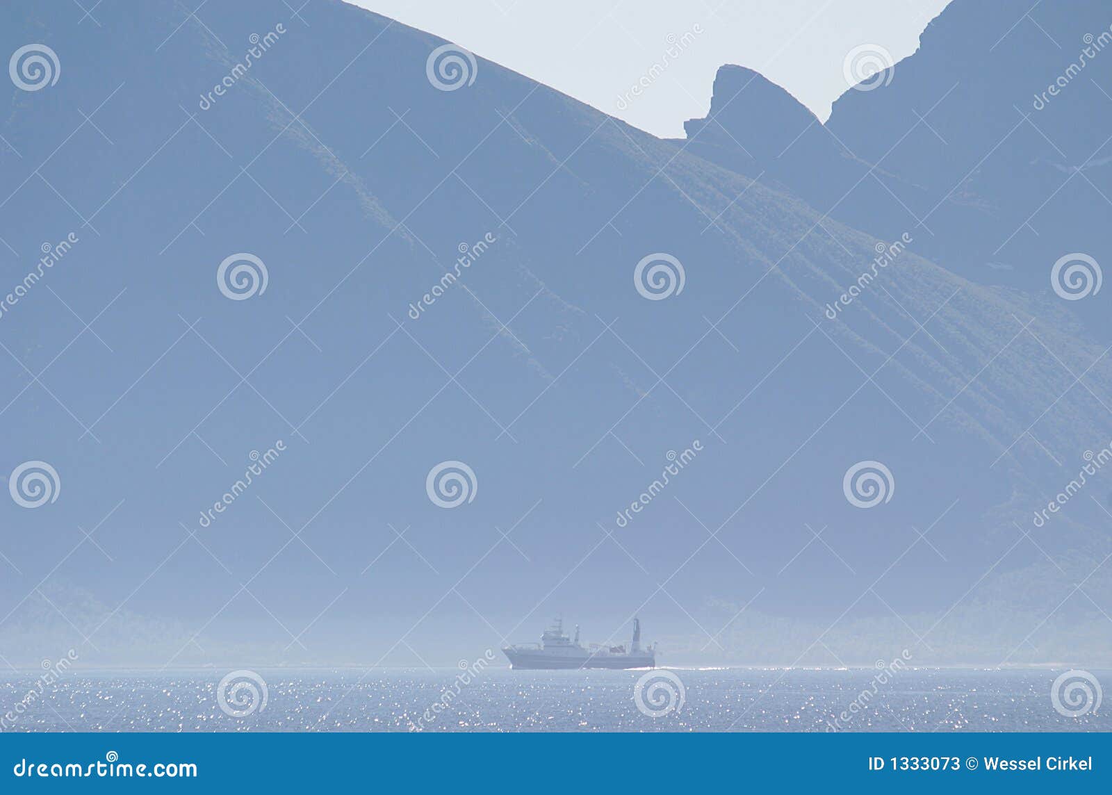 A Ship in Front of Mounts Wrapped in Mist. Stock Image - Image of mood ...
