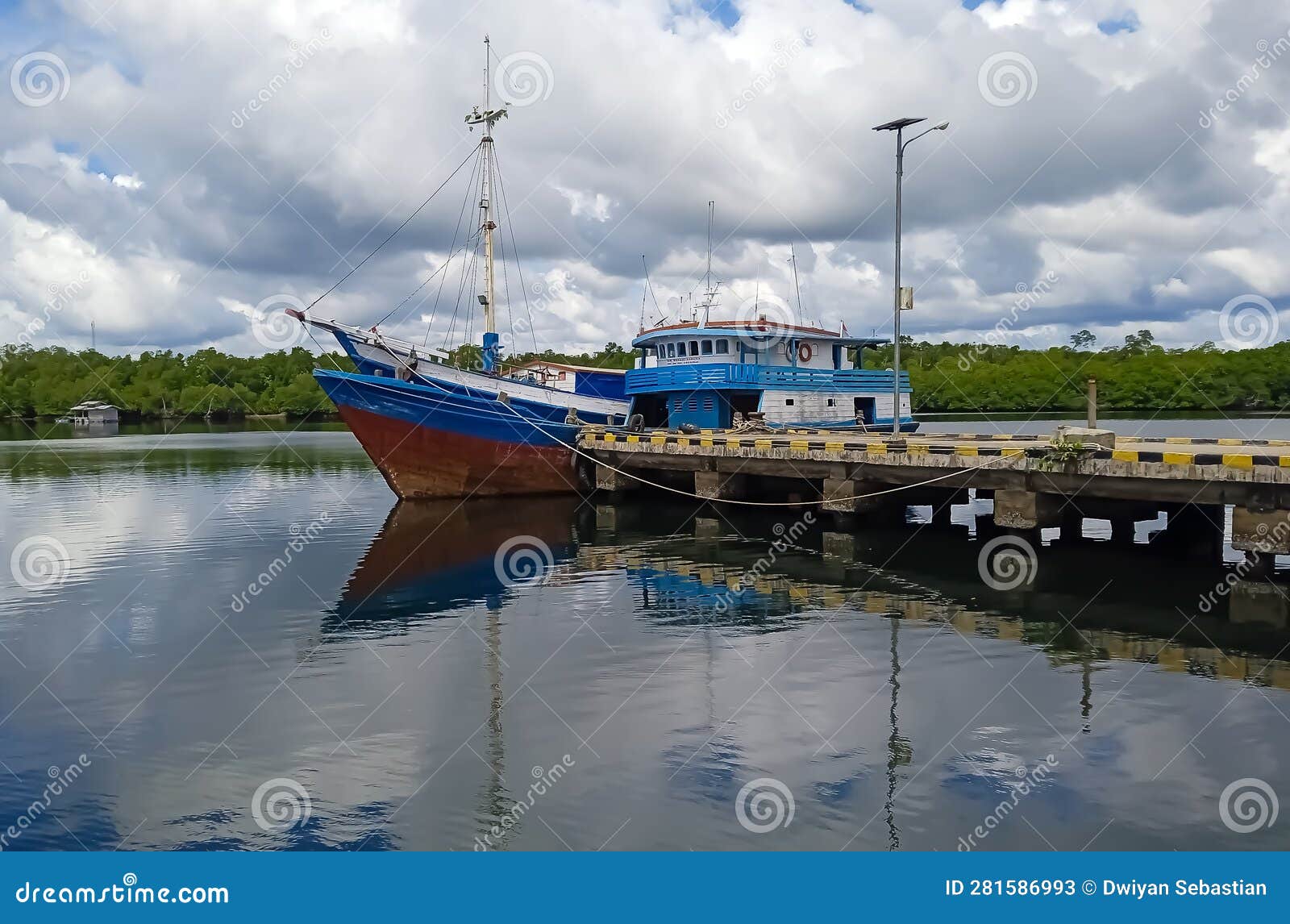 Ship Leaning on the Edge of the Pier. Stock Image - Image of water ...