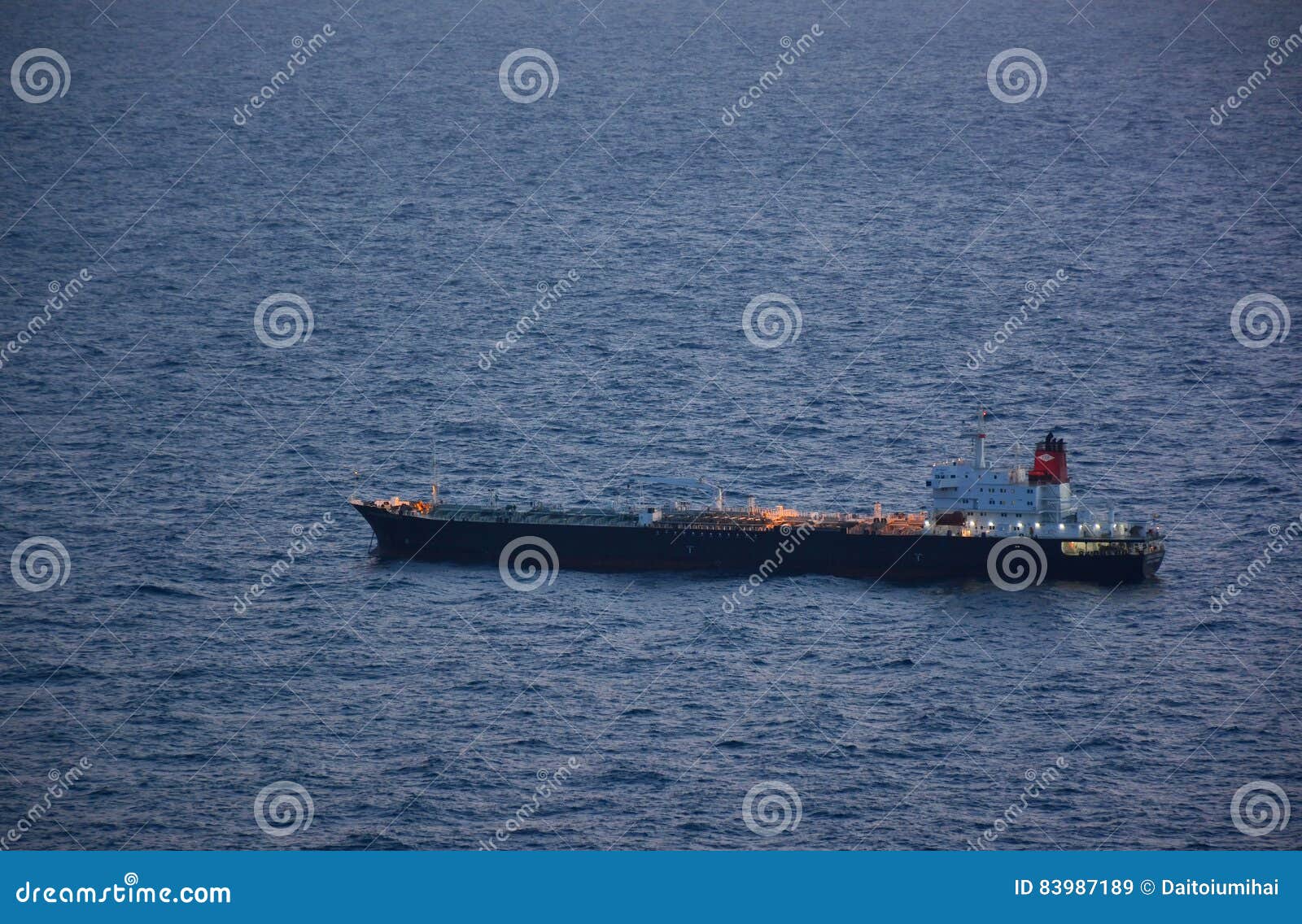 Ship on the ocean at dusk stock image. Image of dock - 83987189