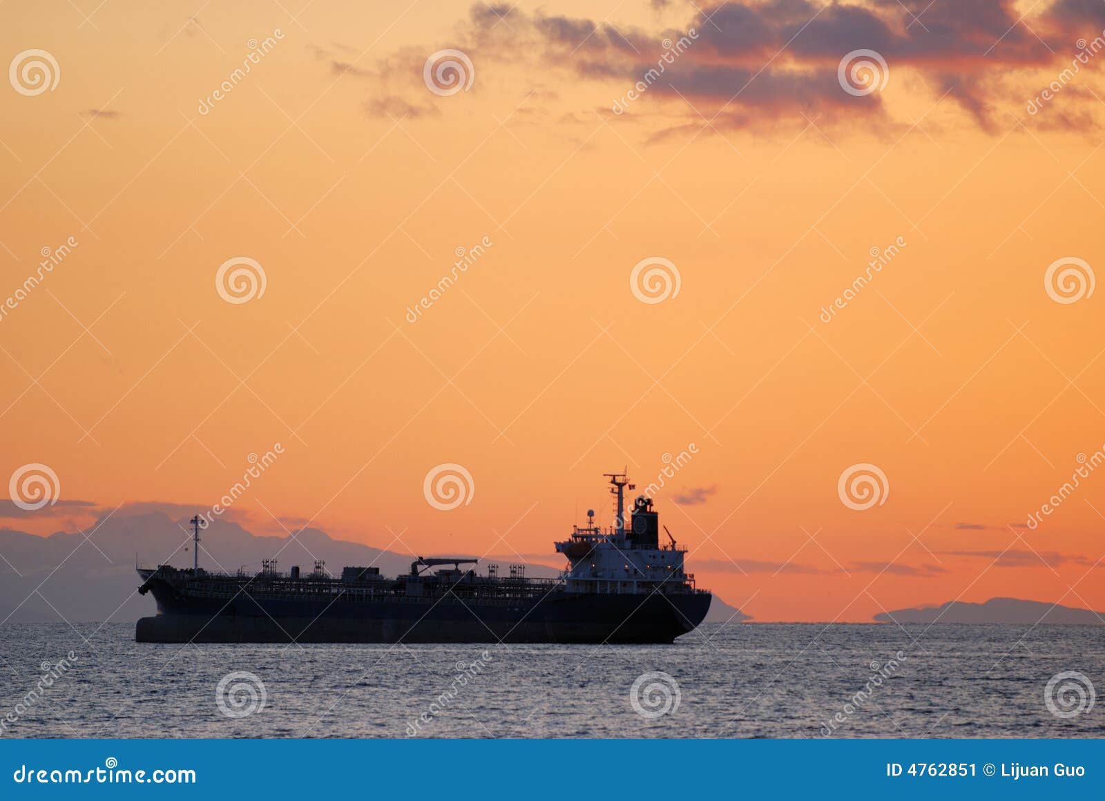Ship in ocean at sunset stock image. Image of commercial - 4762851