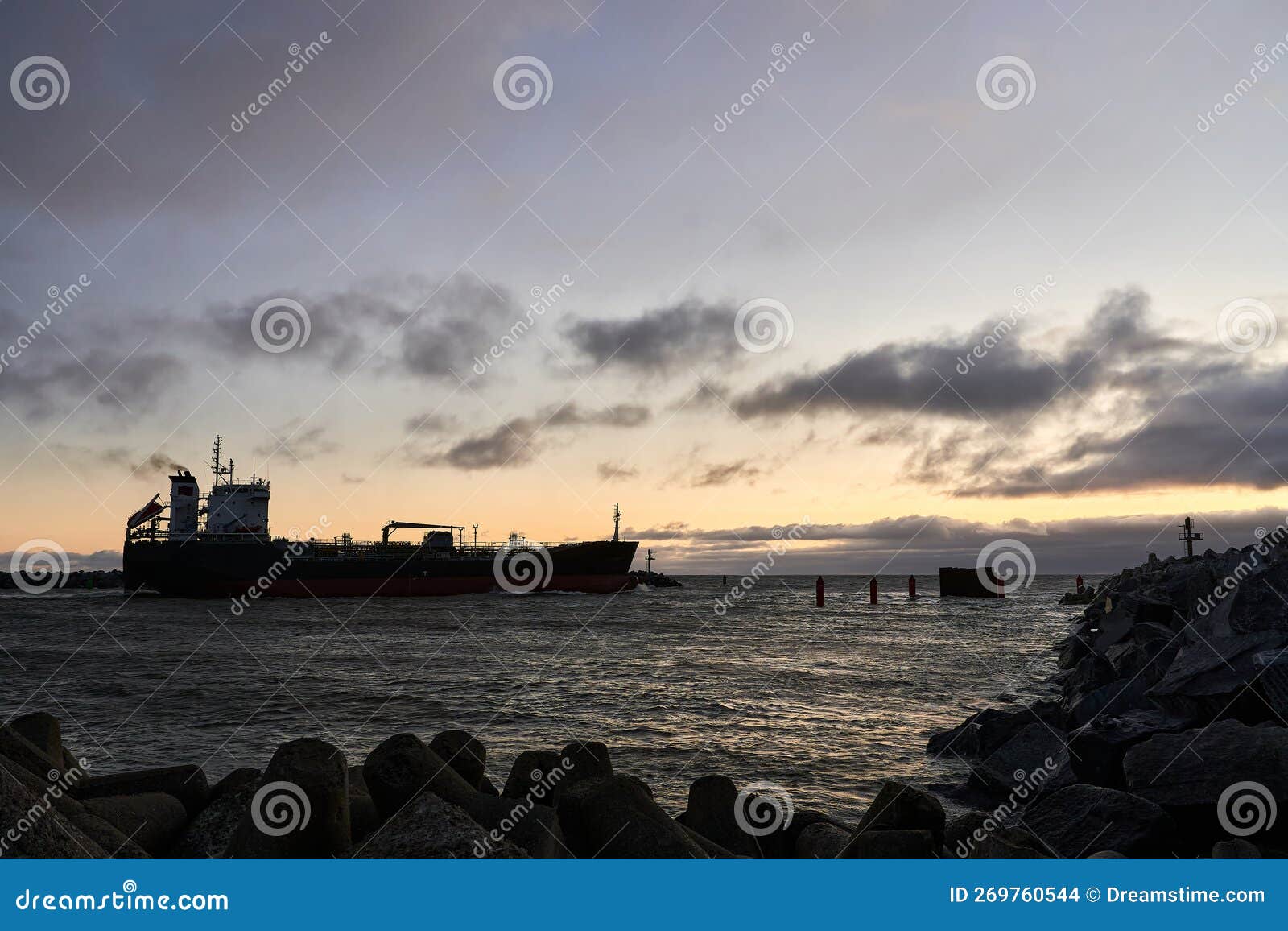 The Ship Passes by a Large Stone Breakwater. the Topic of Shipping and ...