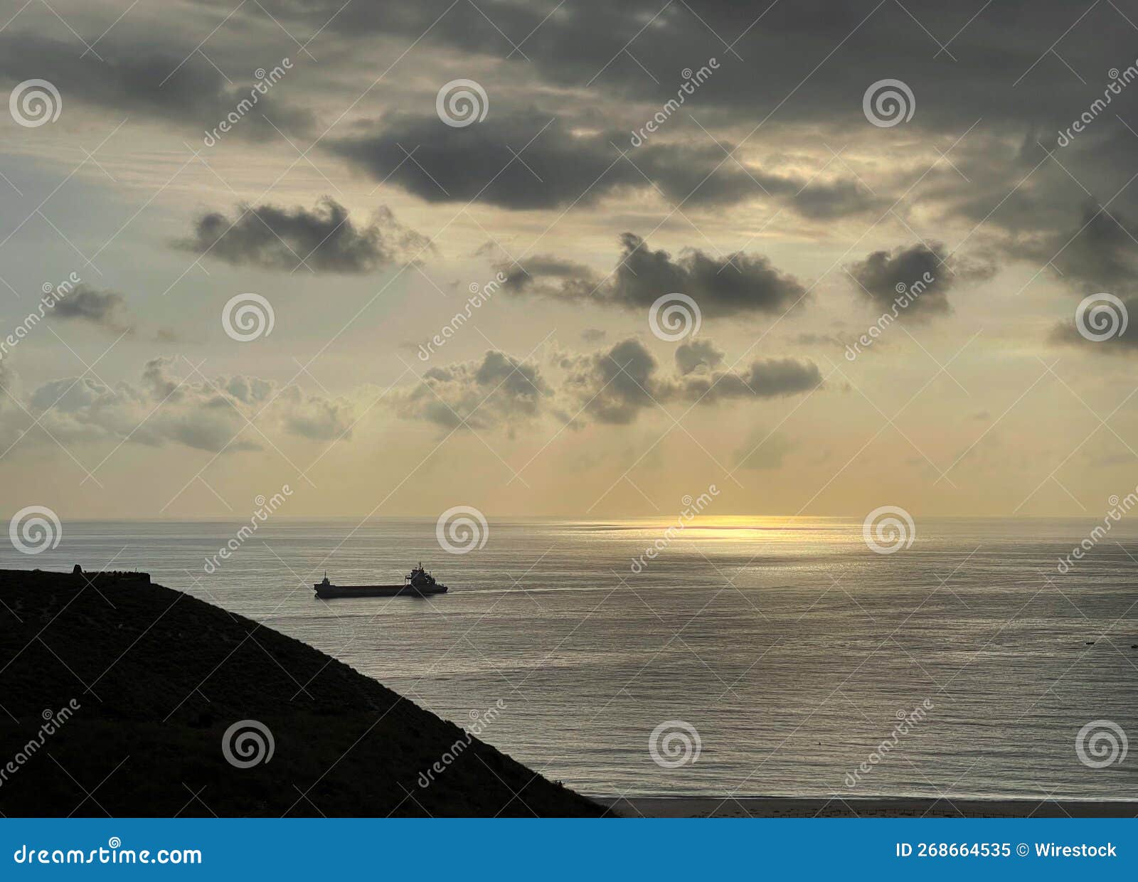 Ship Passing on Calm Sea Surface during a Mild Sunset with Cloudscape ...