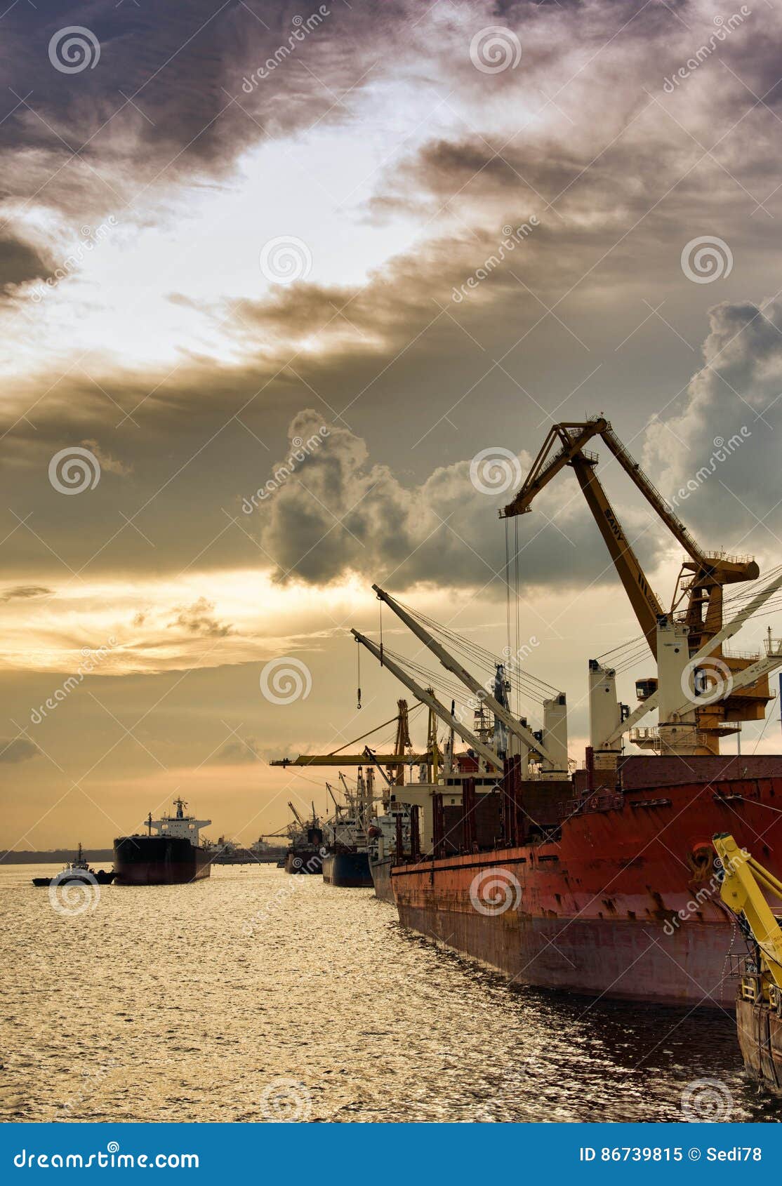 Ship at port during sunset stock image. Image of rust - 86739815