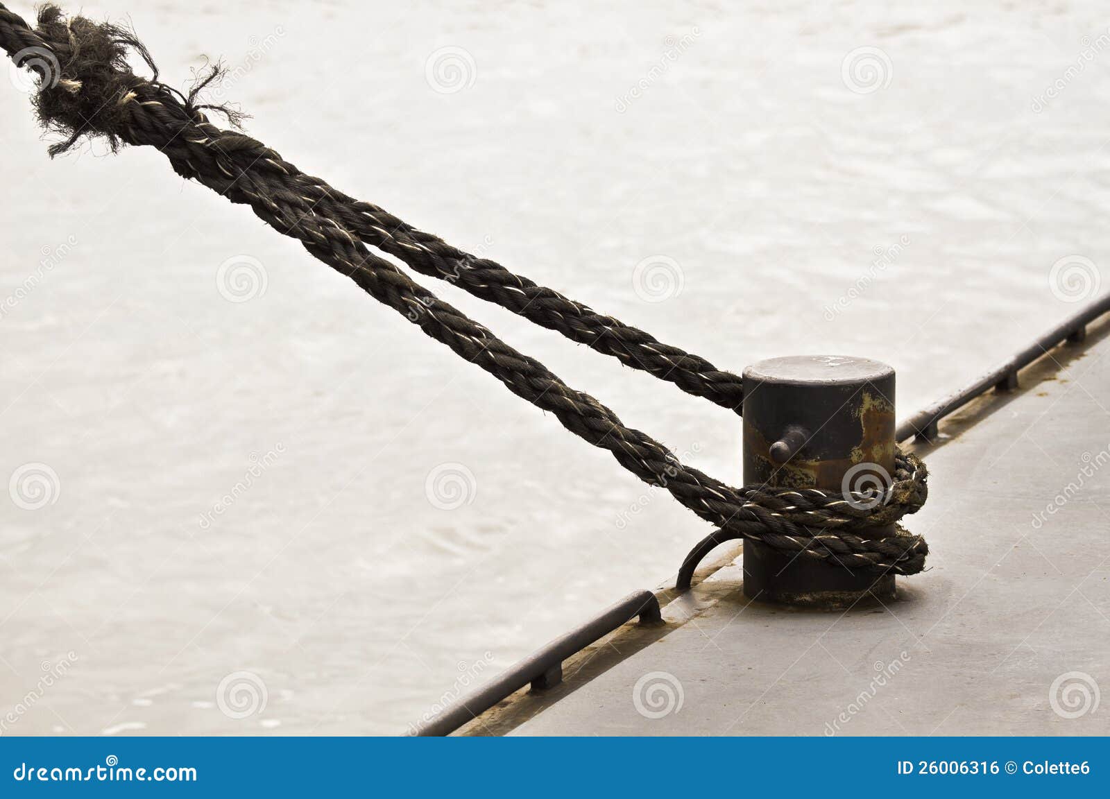 Ship rope and mooring-mast stock photo. Image of ropes - 26006316