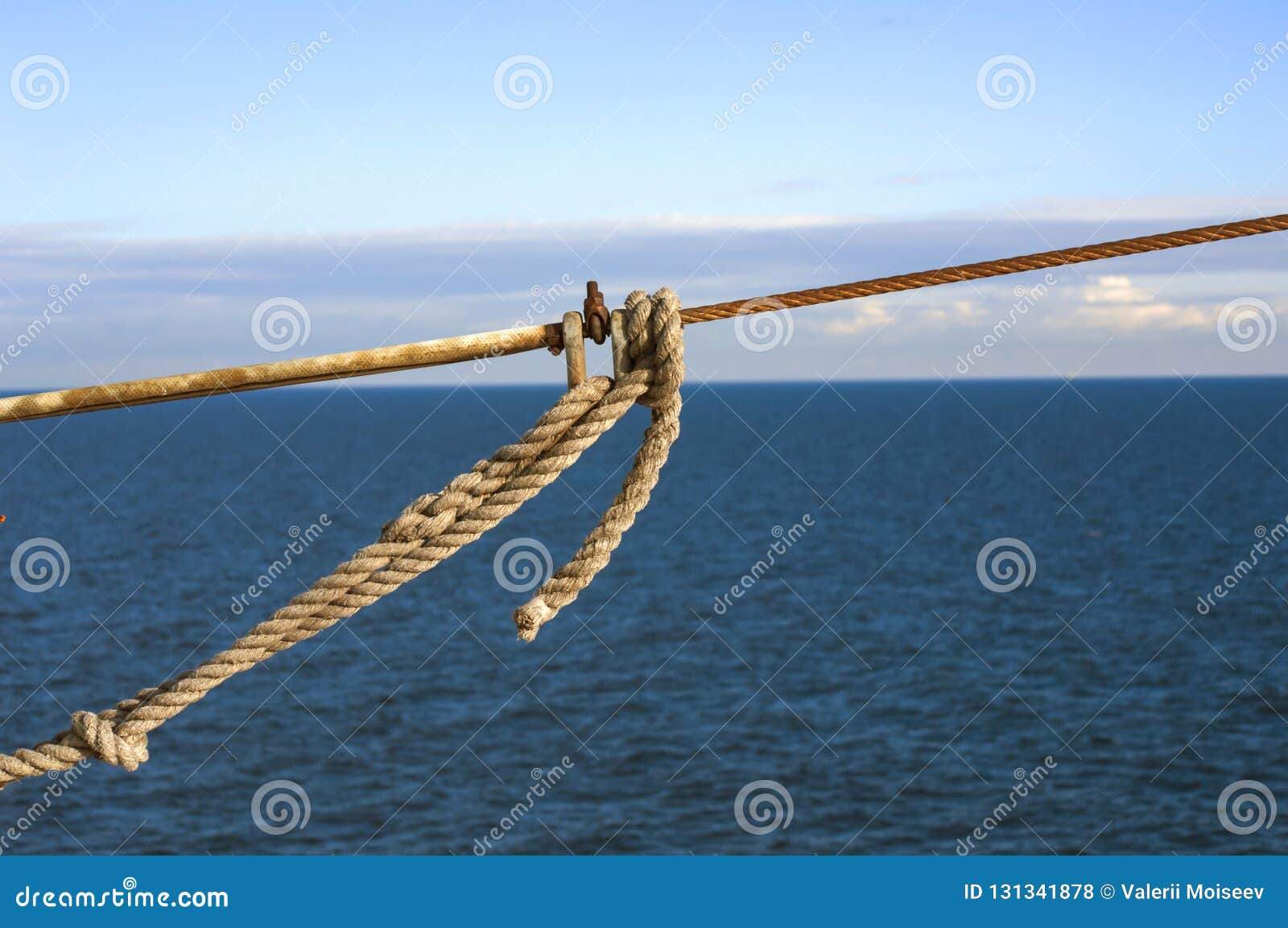 Ship Ropes with a Knot on Blue Sea Background Stock Photo - Image of ...