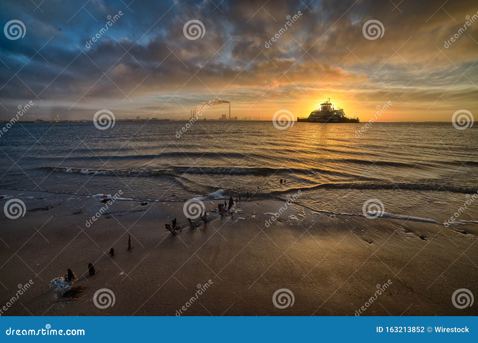 Ship Sailing Over the Sea during a Breathtaking Sunset Under the Cloudy ...