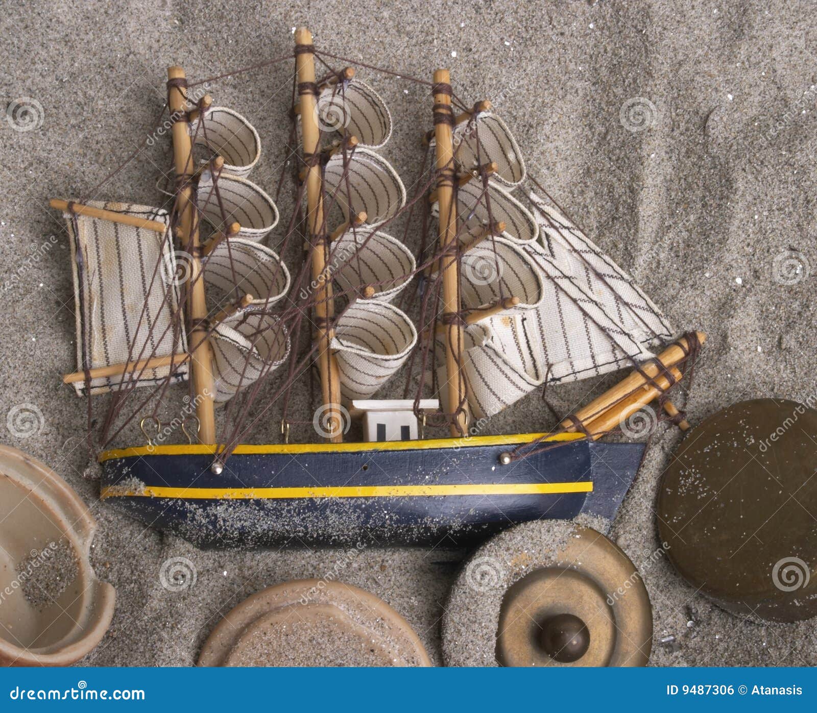 Ship and sails in the sand stock photo. Image of dish - 9487306