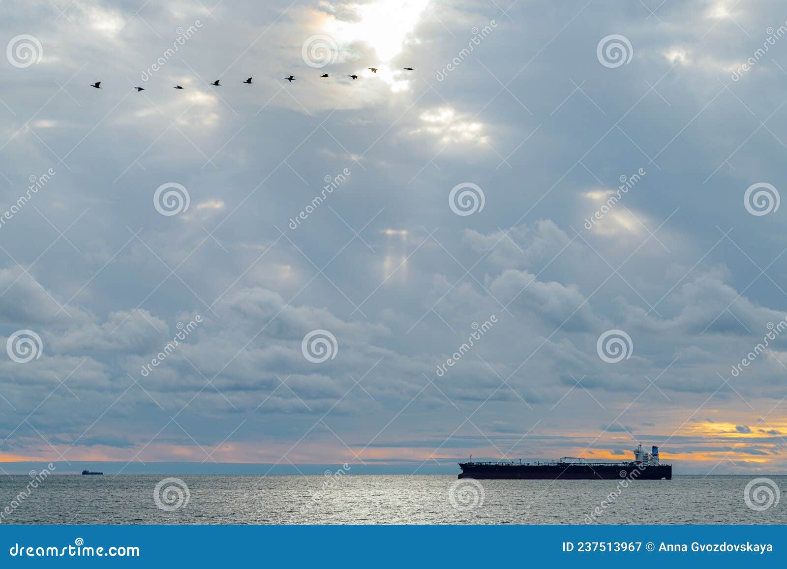 The Ship Sails on the Sea Against the Backdrop of a Beautiful Cloudy ...