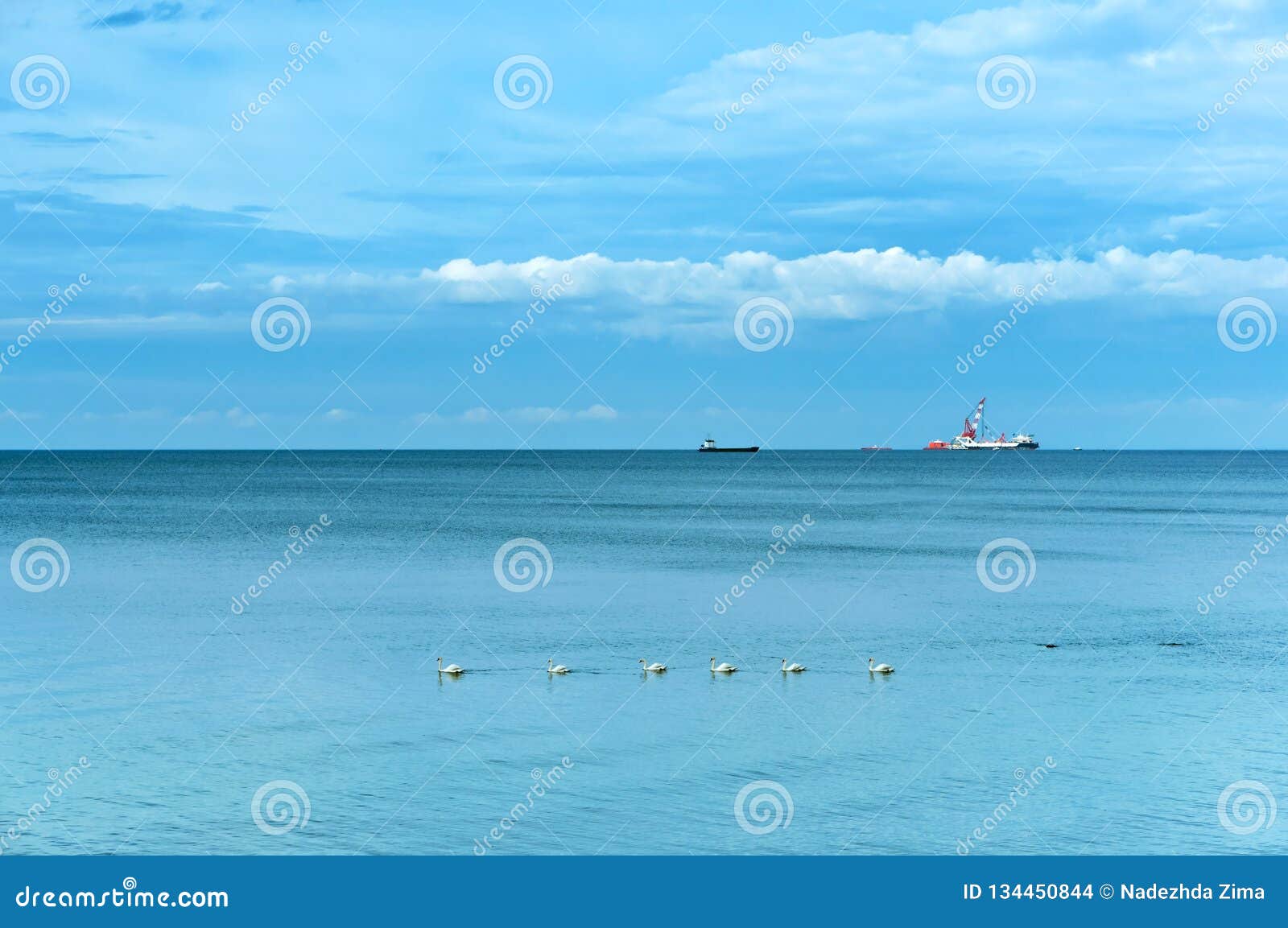 A ship at sea far away stock photo. Image of sunlight - 134450844