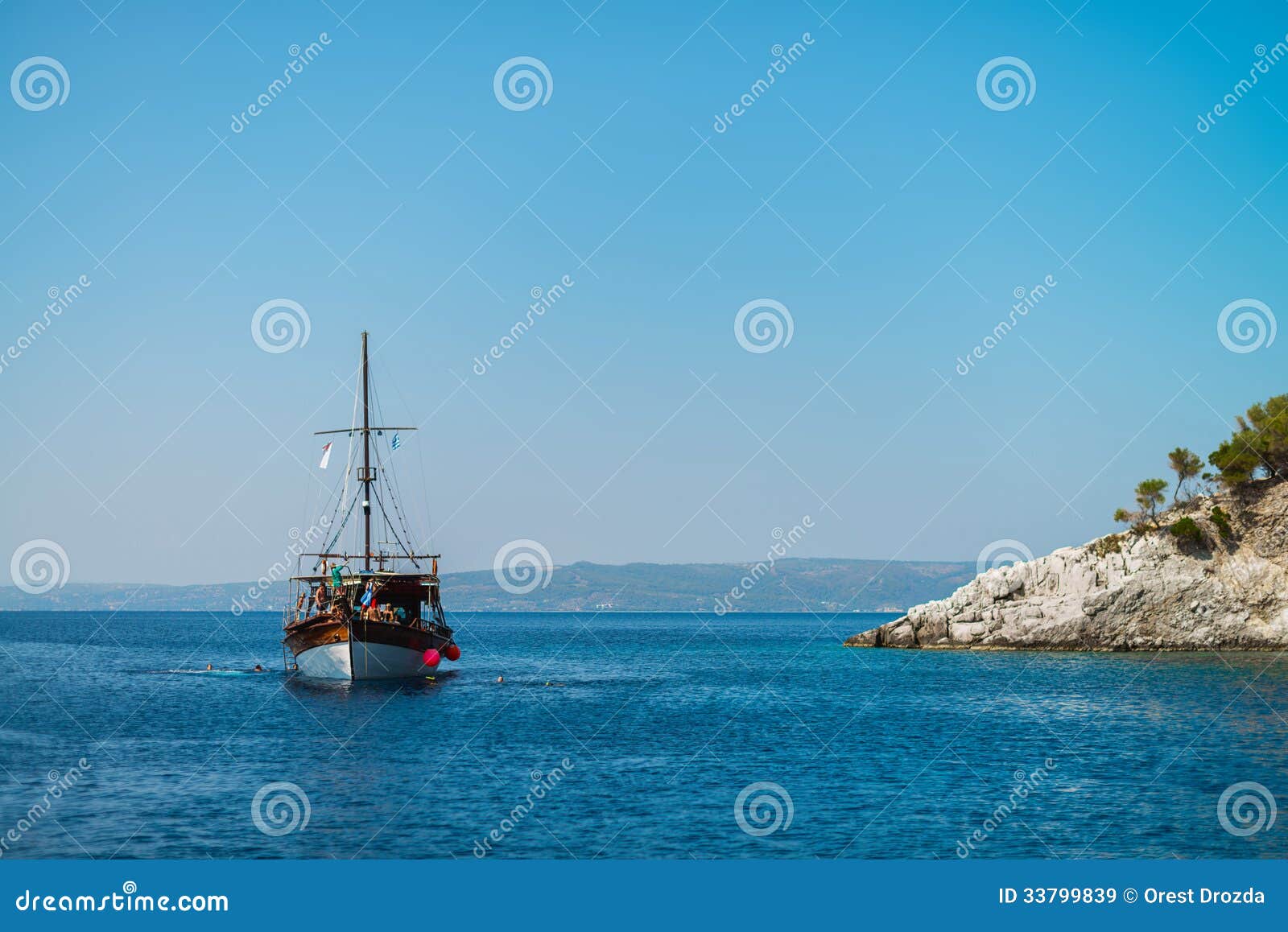 Ship on the sea by rocks stock image. Image of landmark - 33799839