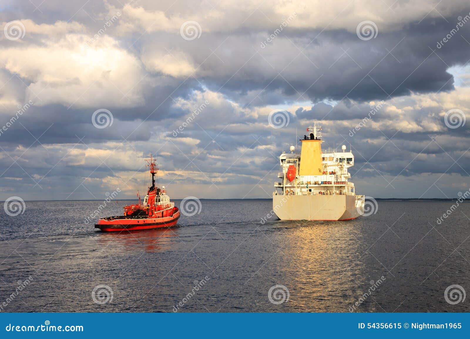 Ship with tugs stock image. Image of tanker, dark, dramatic - 54356615