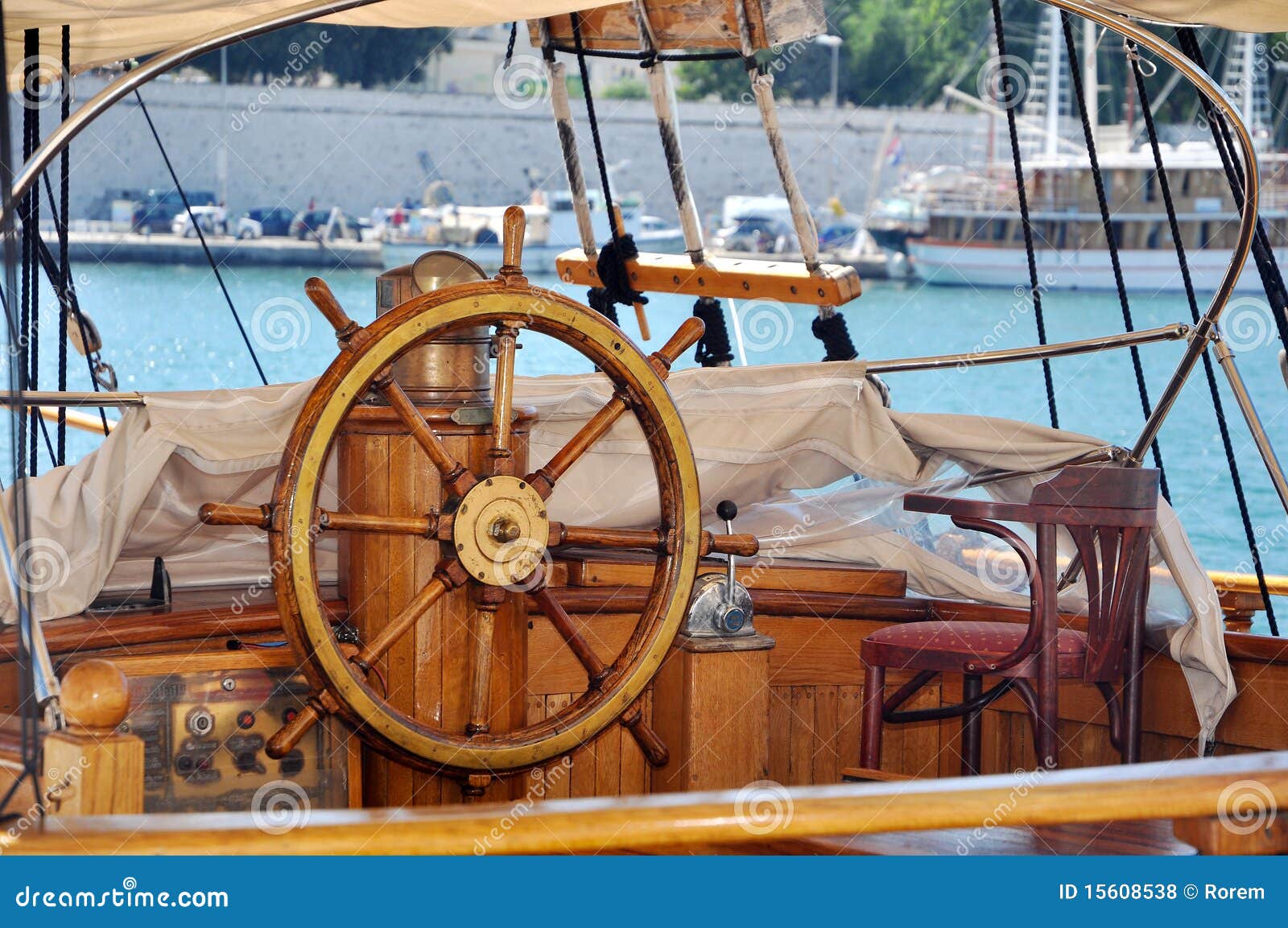 Ship`s Wheel Helm Of An Old Sailing Vessel, Boat Deck With Rope Rigging ...
