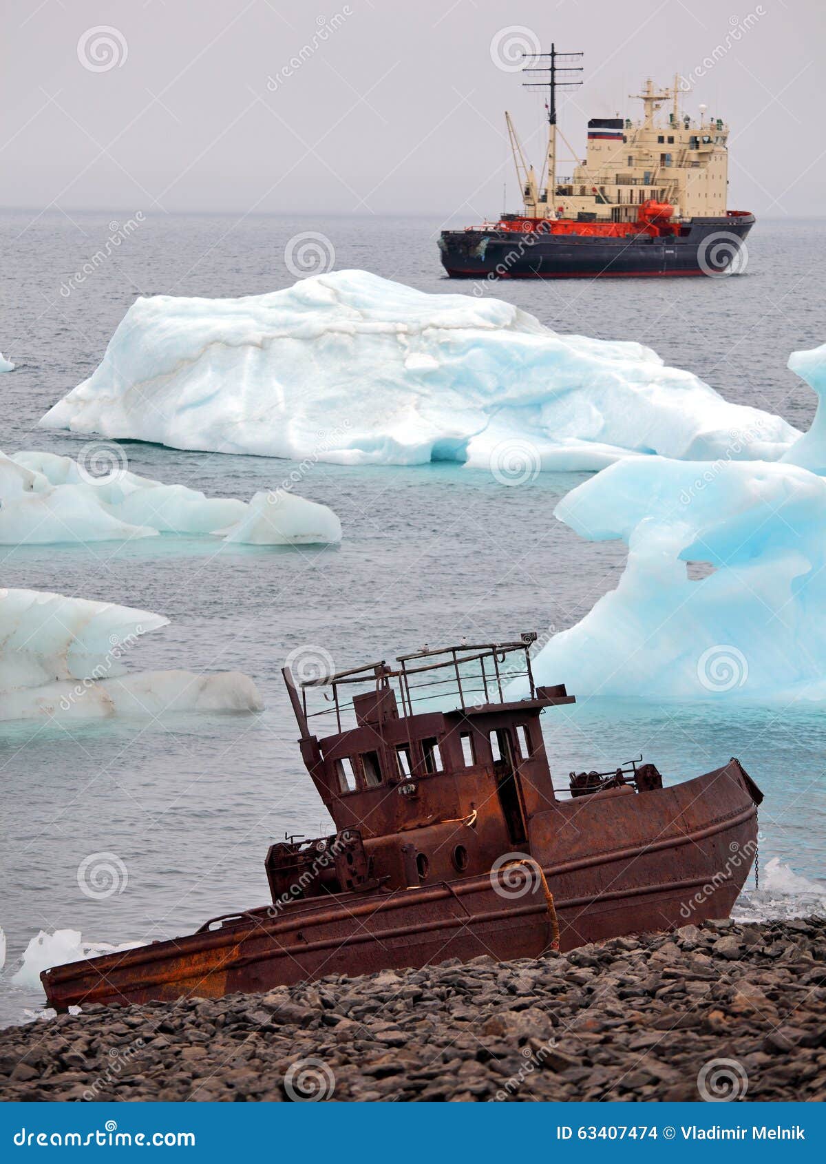 Ship Wreck on Arctic Coast with Icebergs and Icebreaker Stock Photo ...