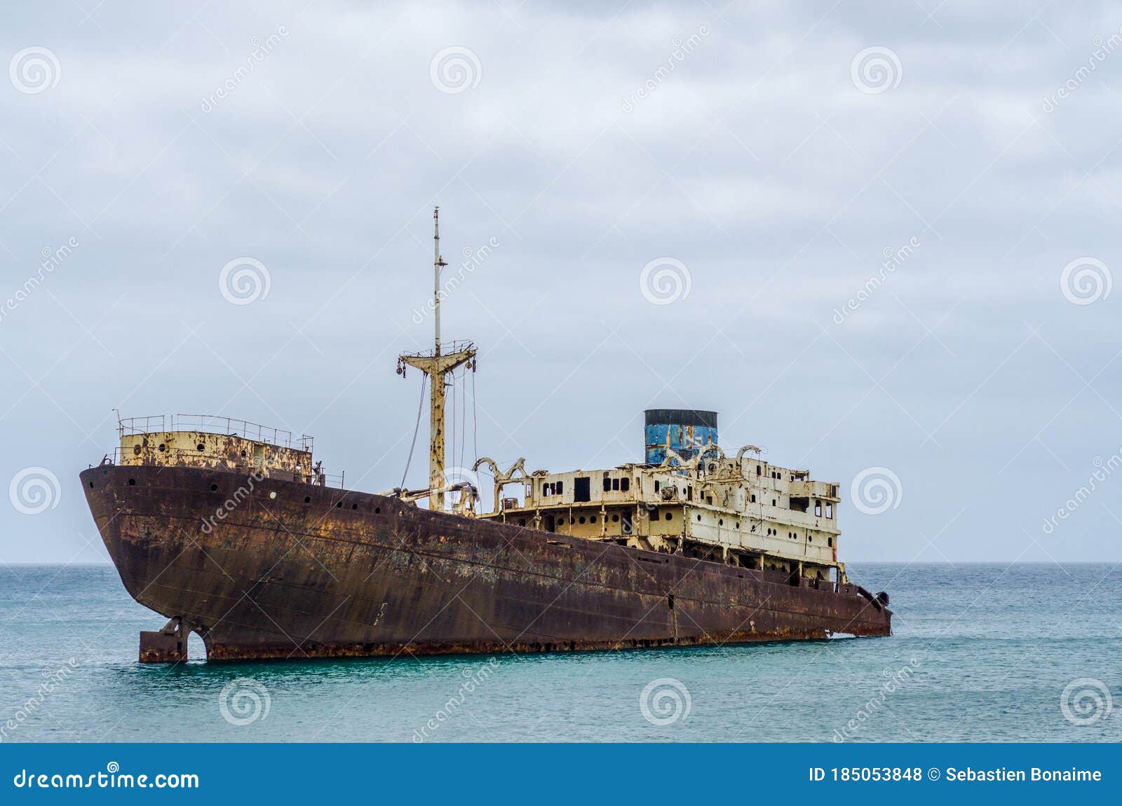 Rusty Ship wreck stock photo. Image of metal, blue, cloudy - 185053848