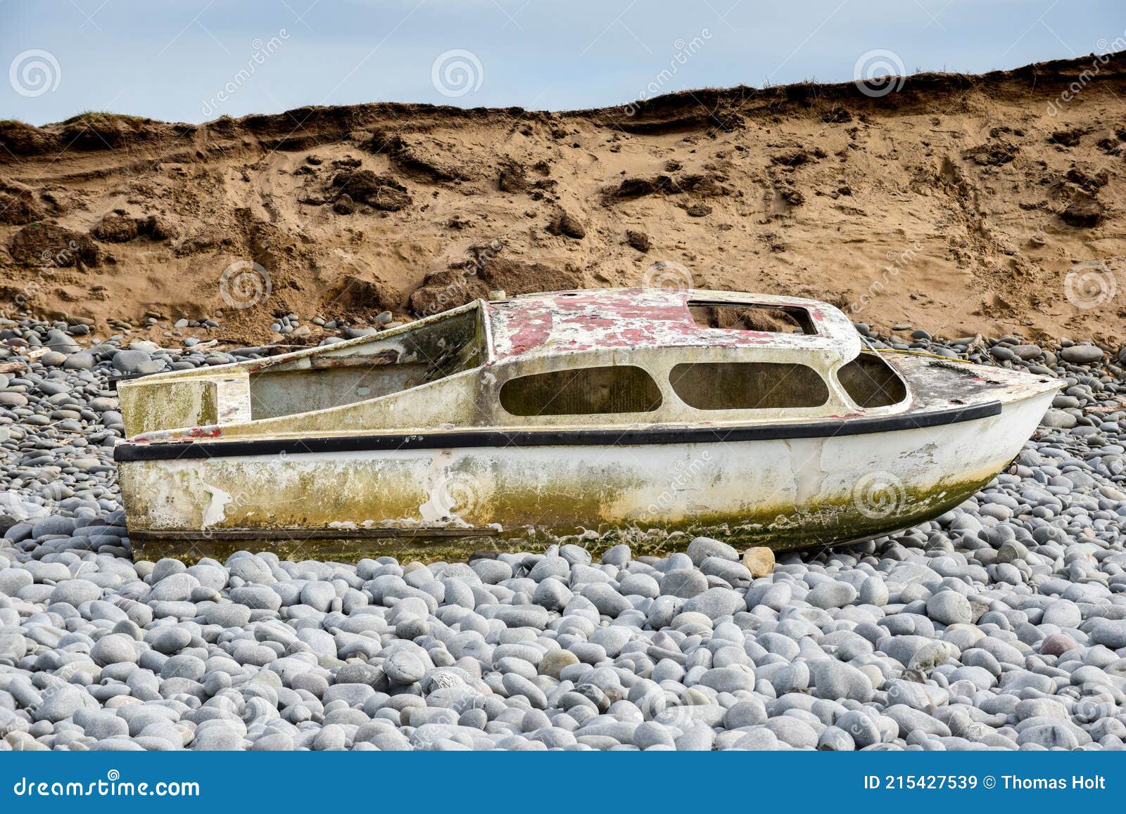 Ship Wreck of an Old Boat Washed Up on a Rocky Beach Stock Image ...