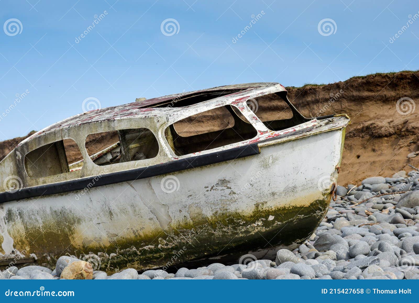 Ship Wreck of an Old Boat Washed Up on a Rocky Beach Stock Photo ...