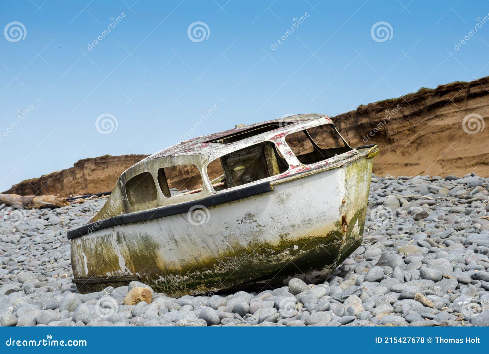 Ship Wreck of an Old Boat Washed Up on a Rocky Beach Stock Photo ...